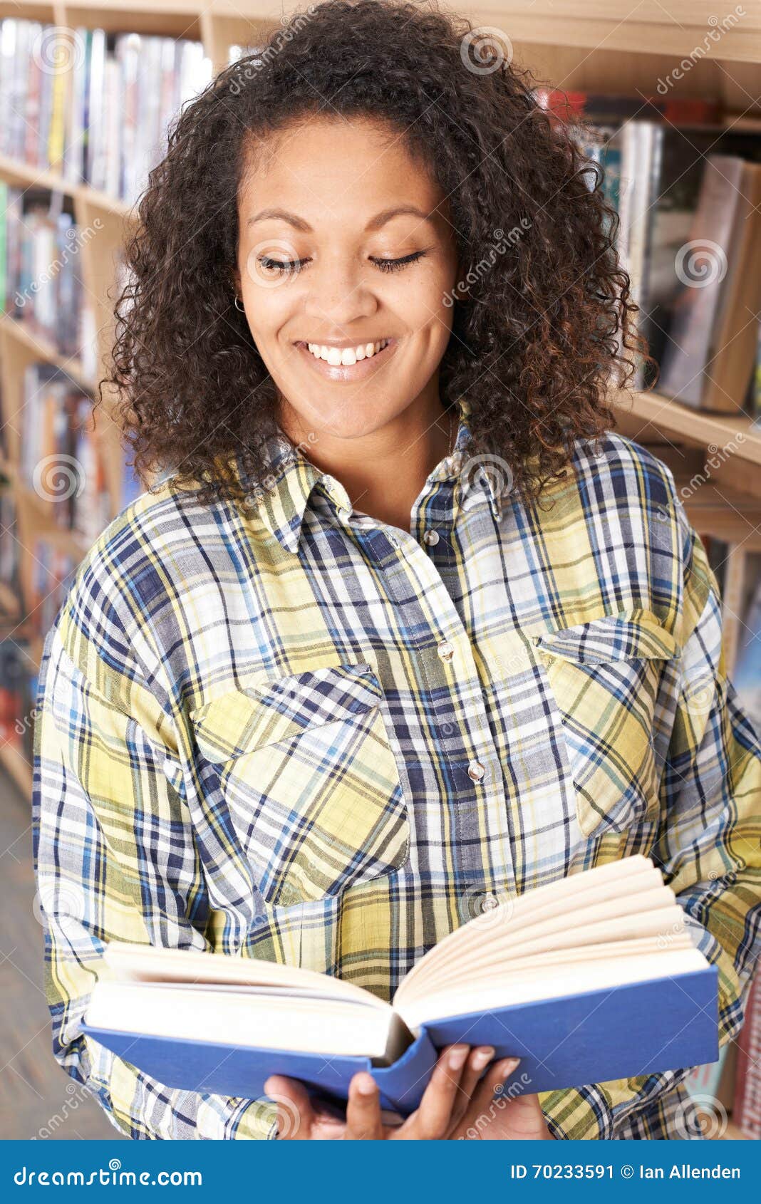 Female Student Reading Book in Library Stock Image - Image of evening ...