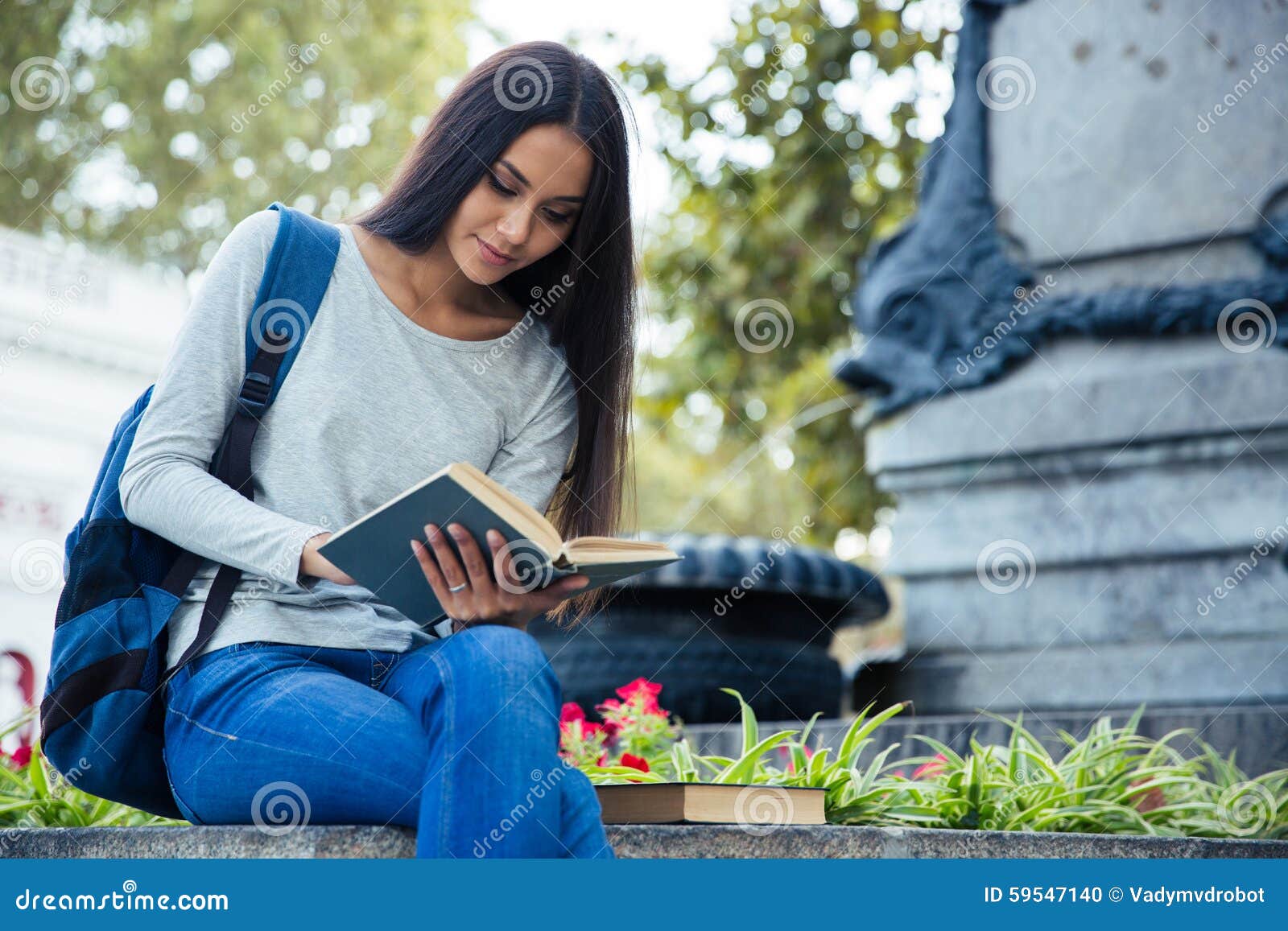 Female Student Reading Book Outdoors Stock Photo - Image of cute, exam ...