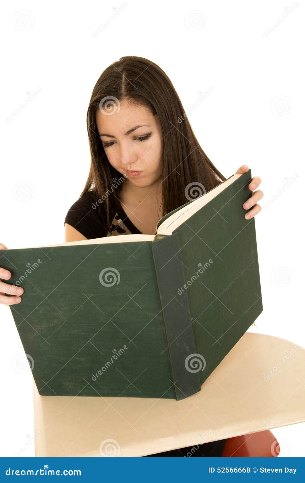 Female Student Reading a Large Book with a Confused Expression Stock ...