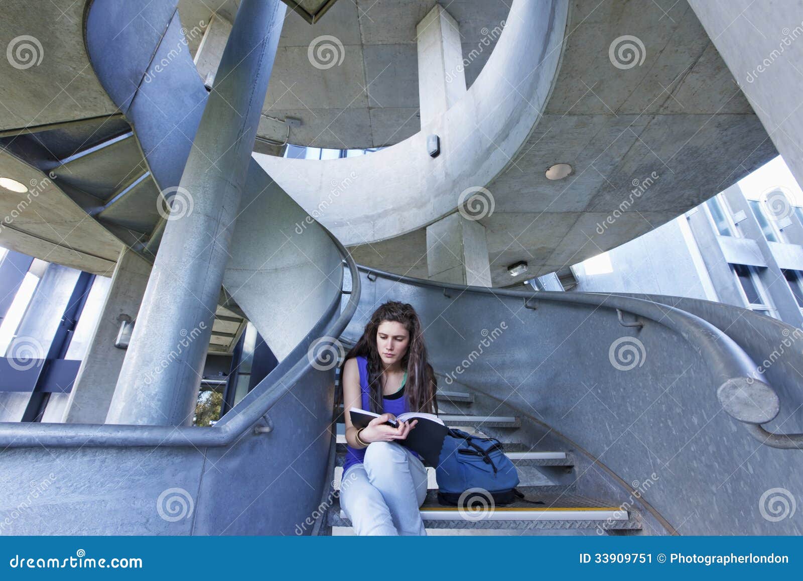 Female Student Reading on Staircase Stock Image - Image of casual ...