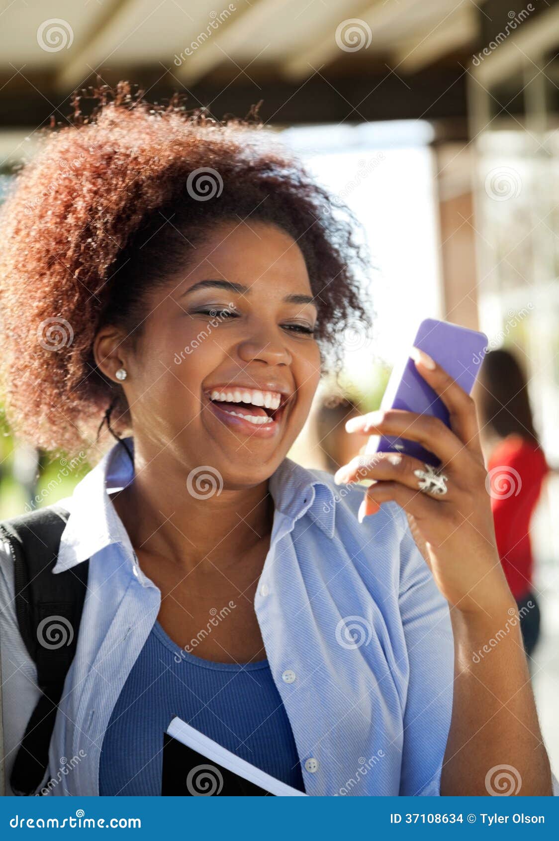 Female Student Reading Text Message on Mobilephone Stock Photo - Image ...