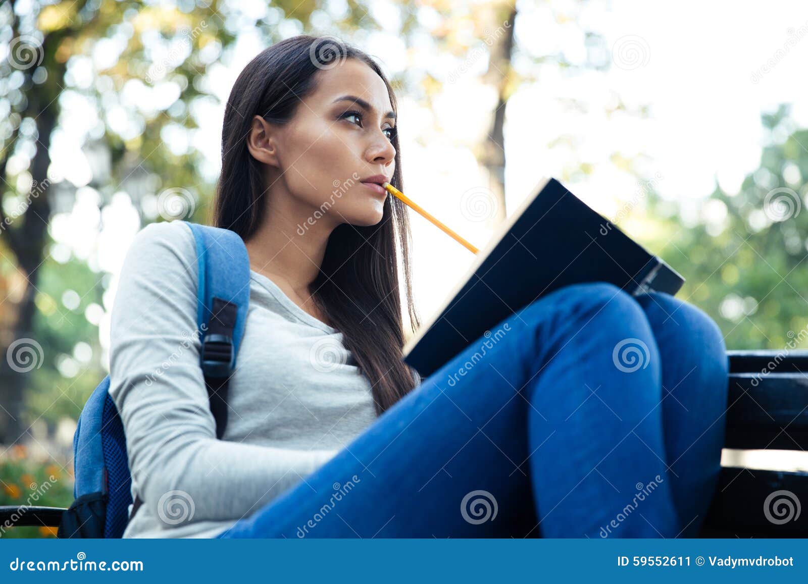 Female Student Sitting on the Bench with Book Stock Image - Image of ...