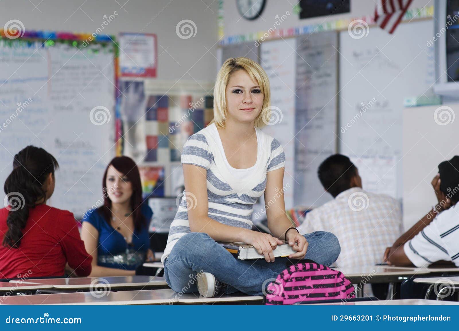 Female Student Sitting on Bench in Classroom Stock Image - Image of ...