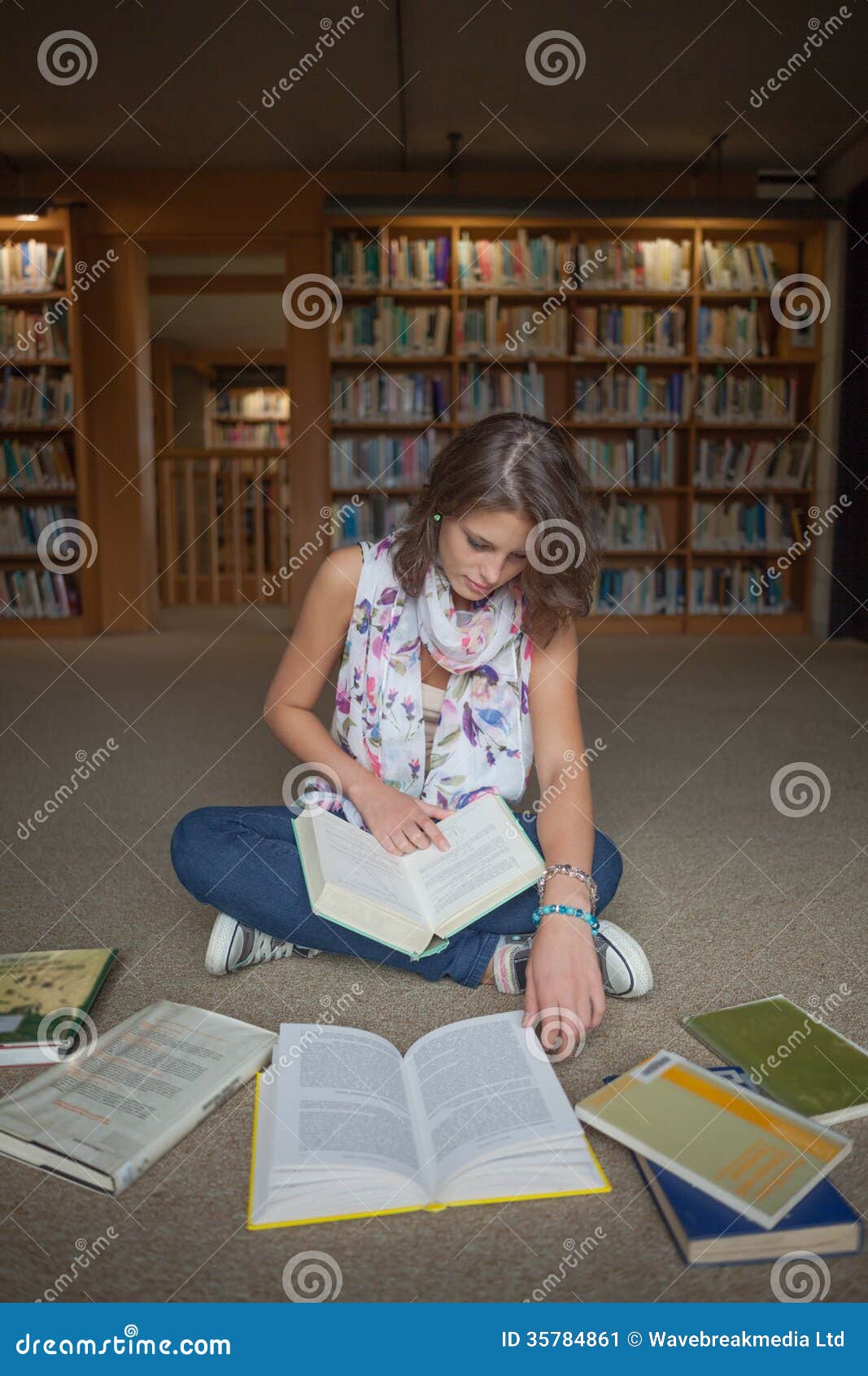 Female Student Sitting with Books on the Library Floor Stock Image ...