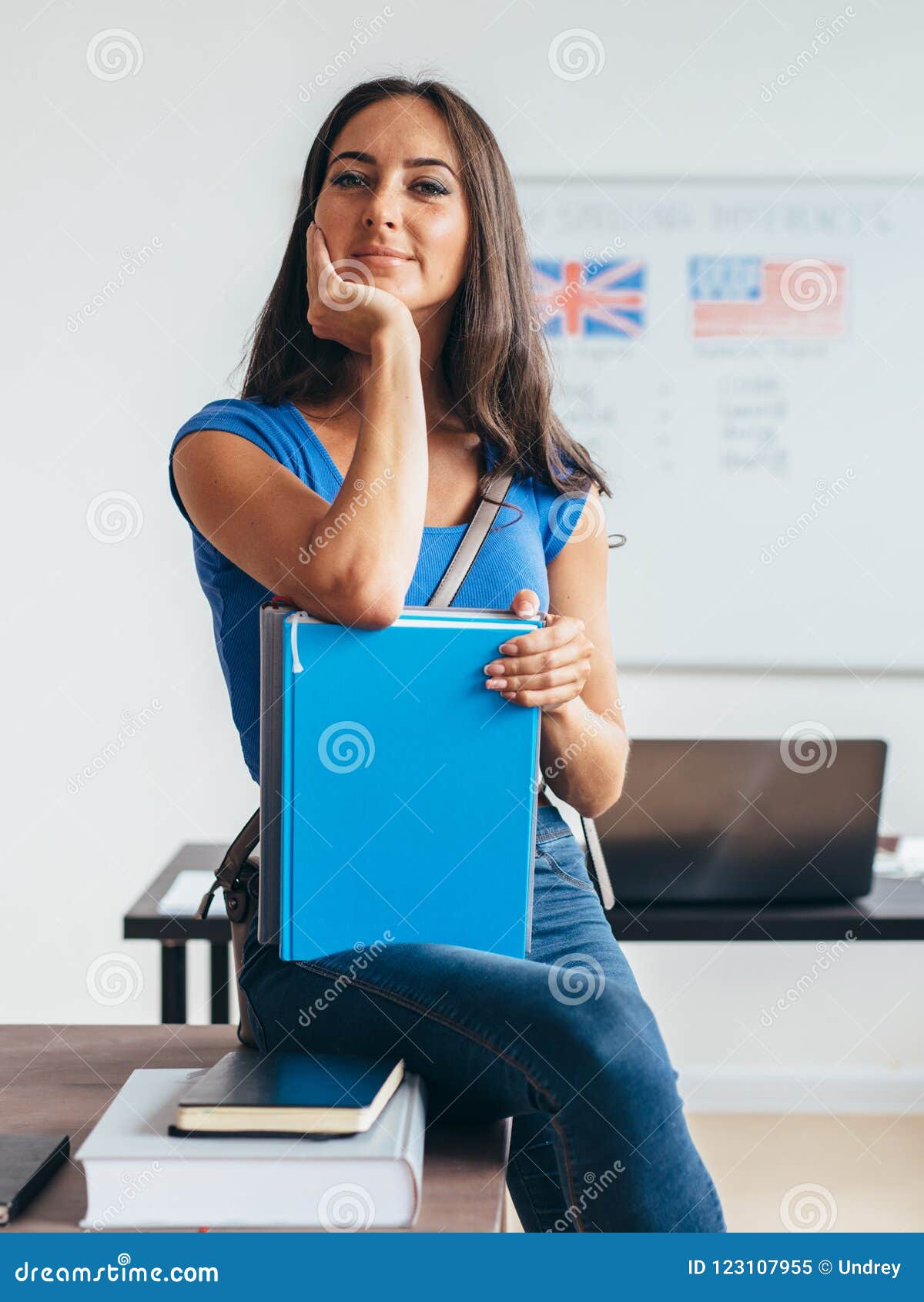 Female Student Sitting at Table Smiling and Looking at Camera. Stock ...