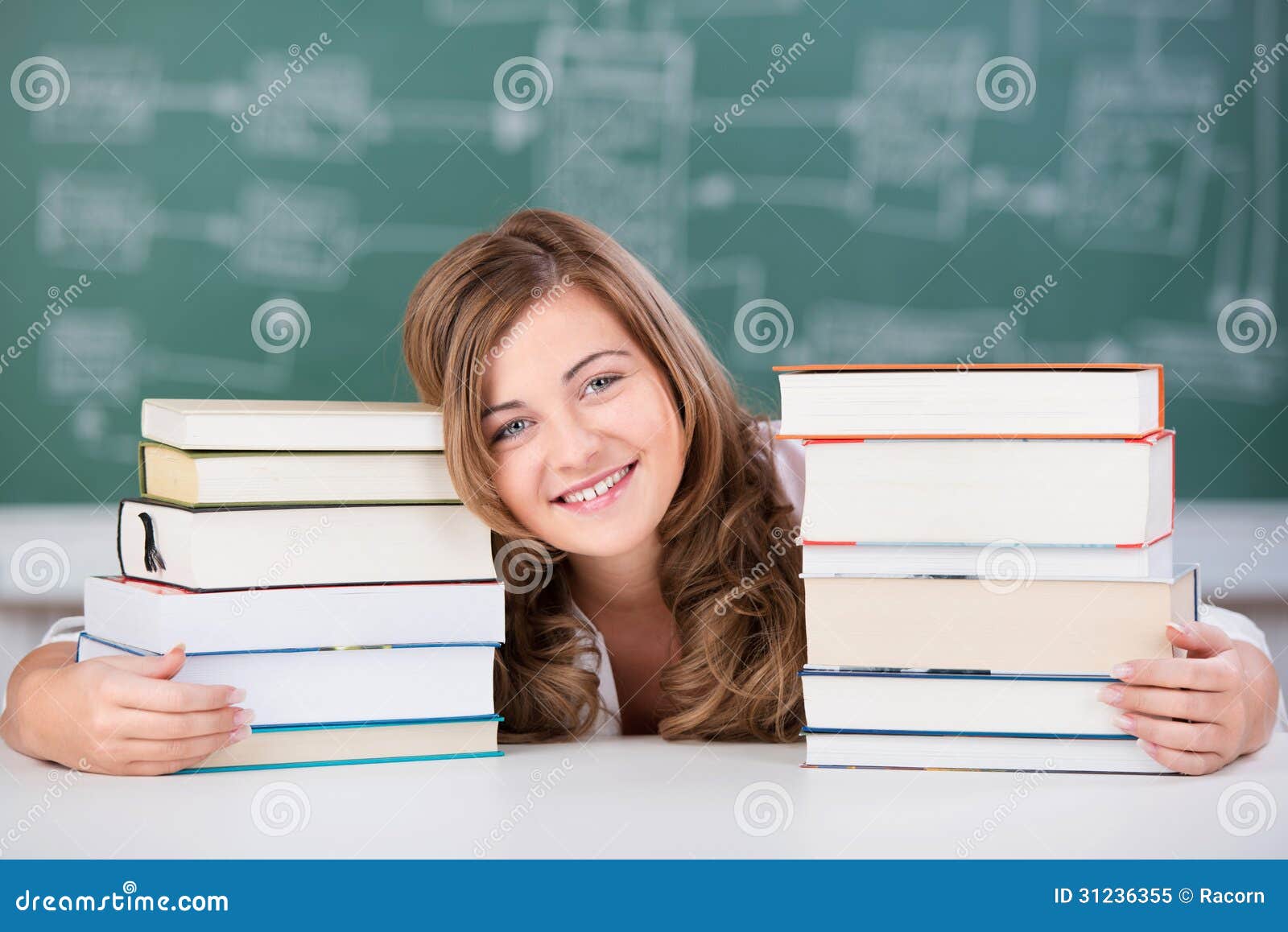 Female Student with Stack of Books at Table Stock Image - Image of ...