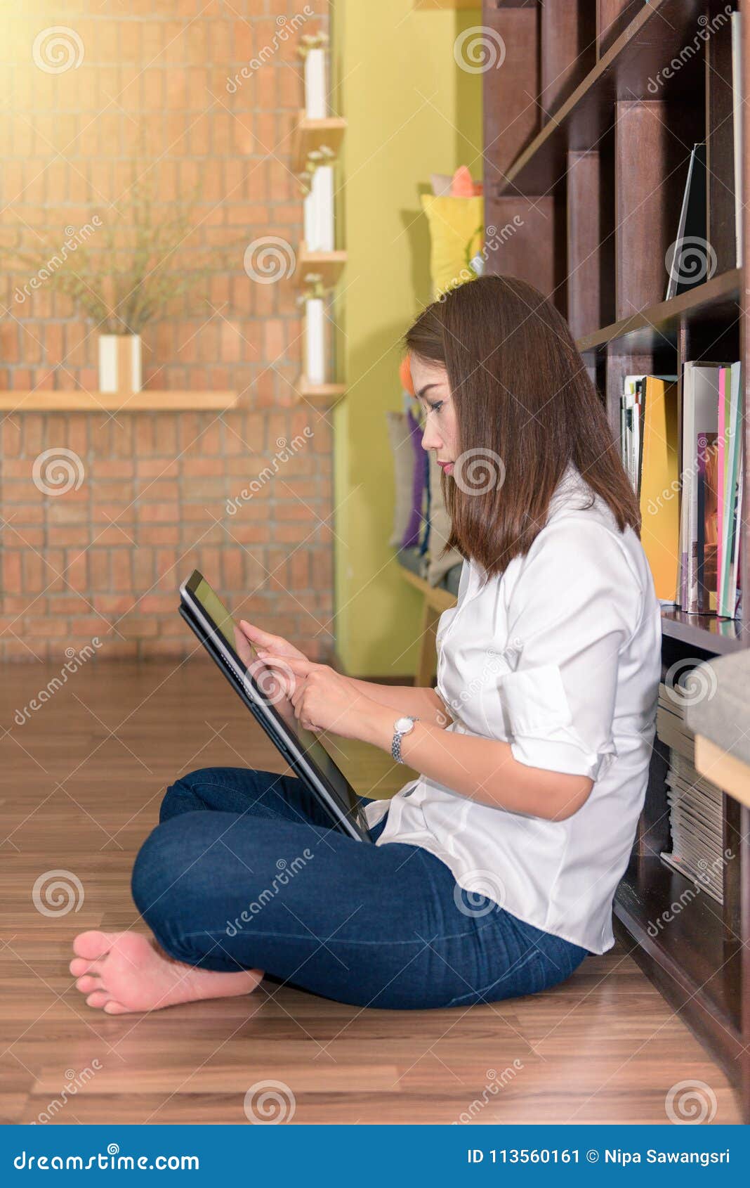 Female Student Study in School Library Sitting Against Bookshelf Stock ...