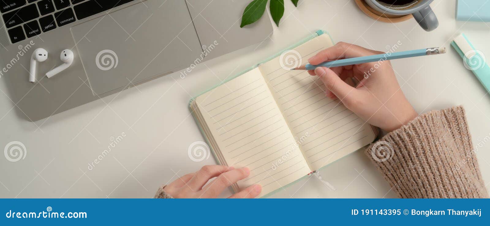 Female Student Taking Note on Blank Notebook while Doing Assignment ...