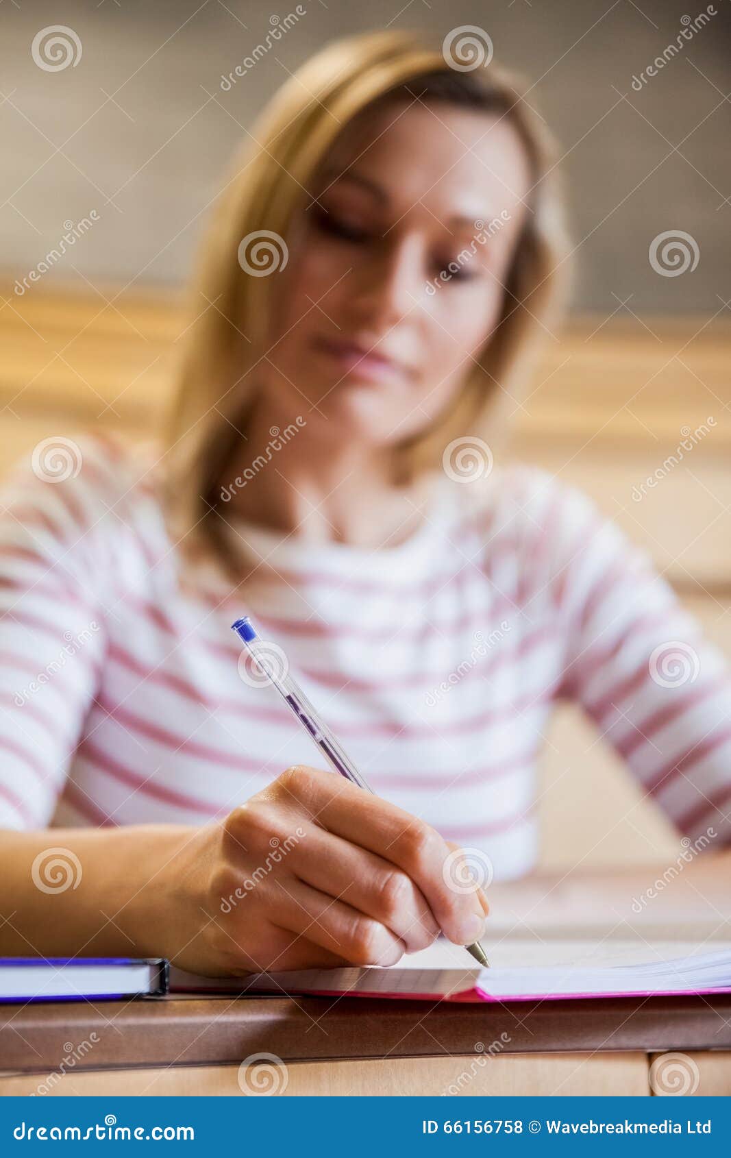 Female Student Taking Notes in a Class Stock Photo - Image of academic ...