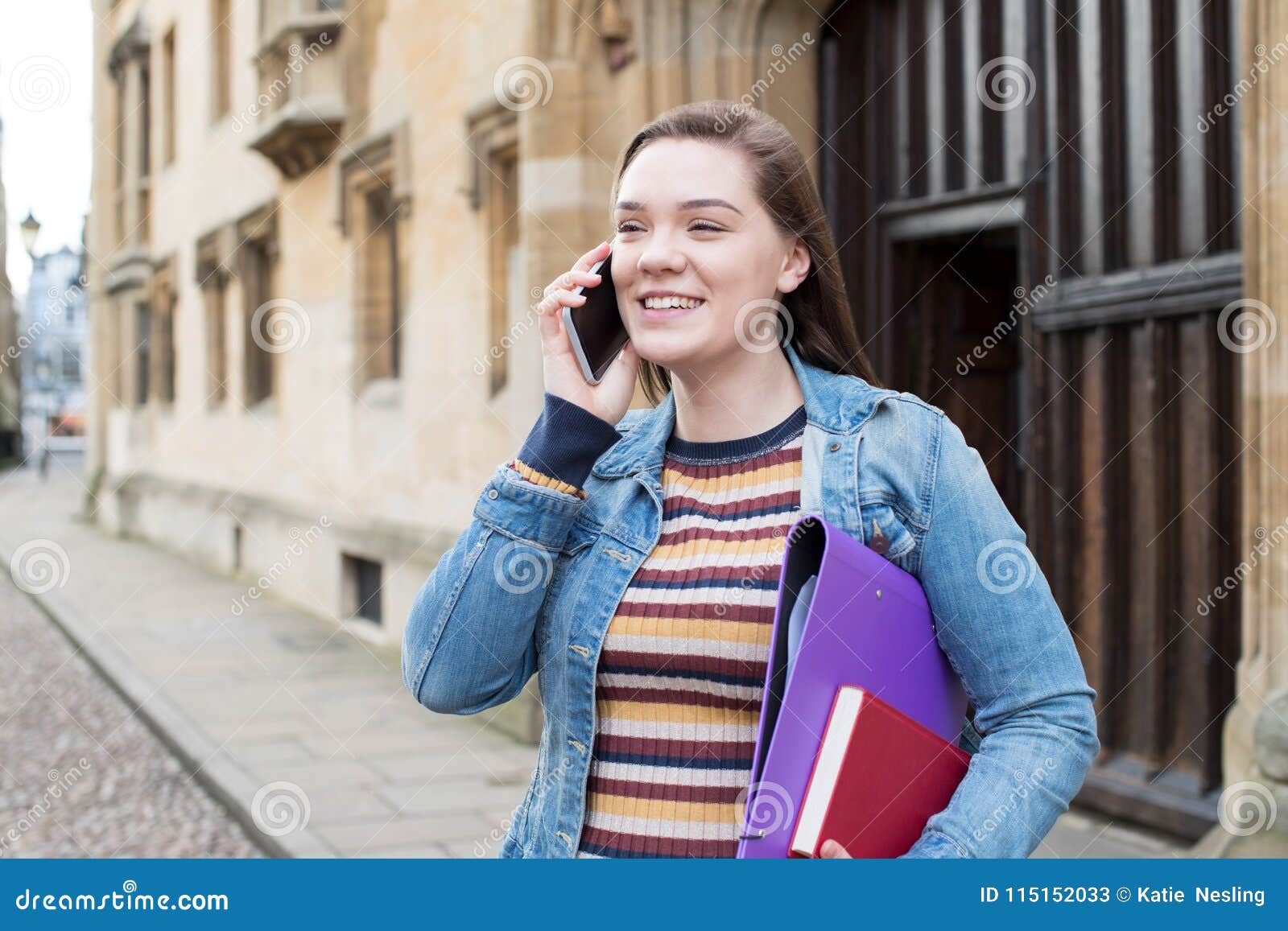 Female Student Talking on Mobile Phone Outside College Building Stock ...