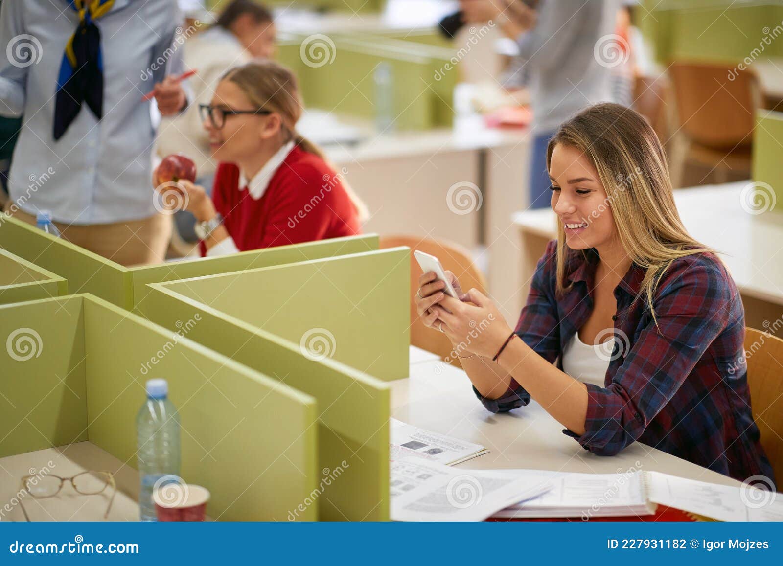Female Student Texting in a Break of the Lecture. Smart Young People ...