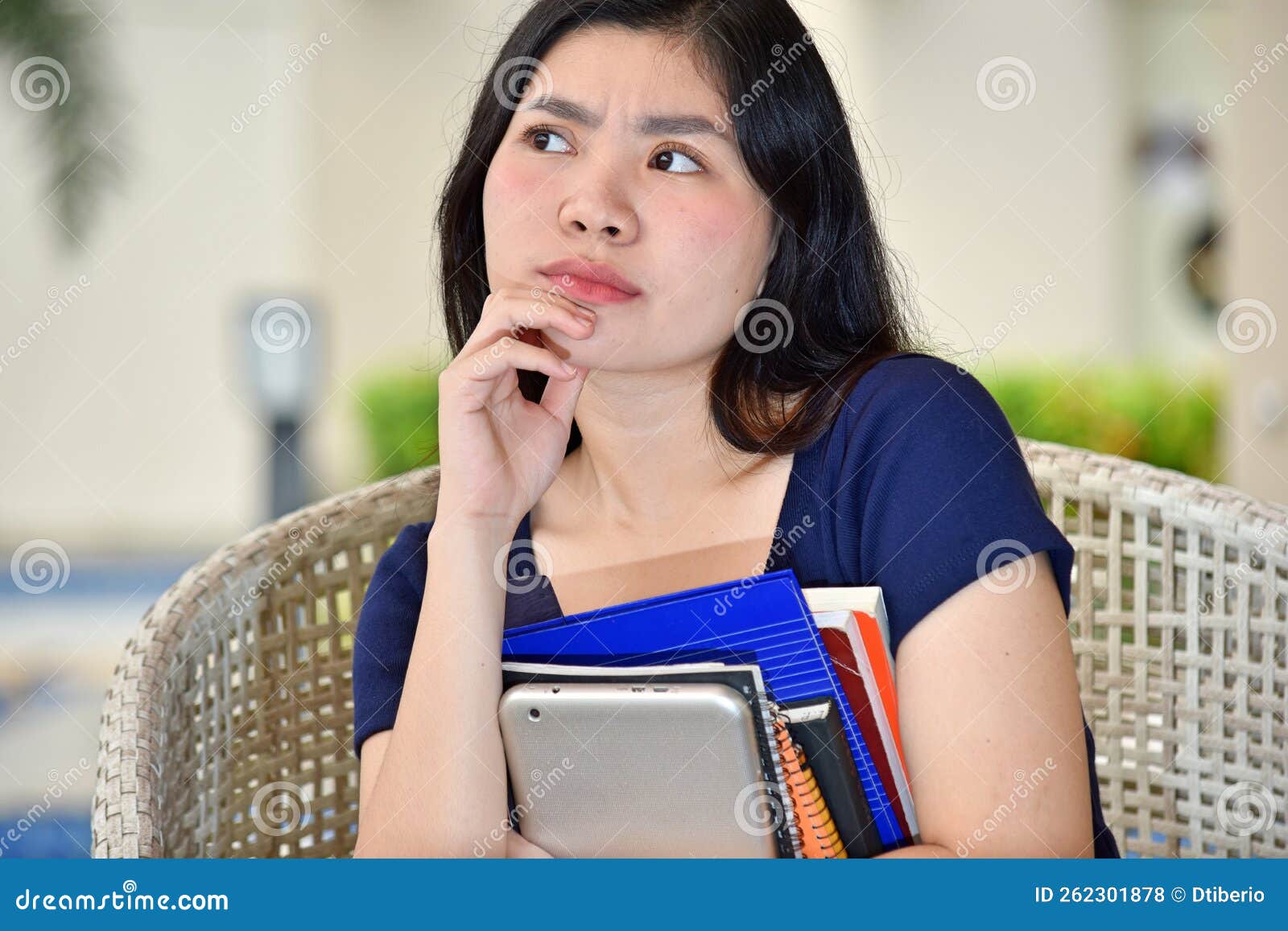 A Female Student Thinking with Notebooks Stock Photo - Image of ...