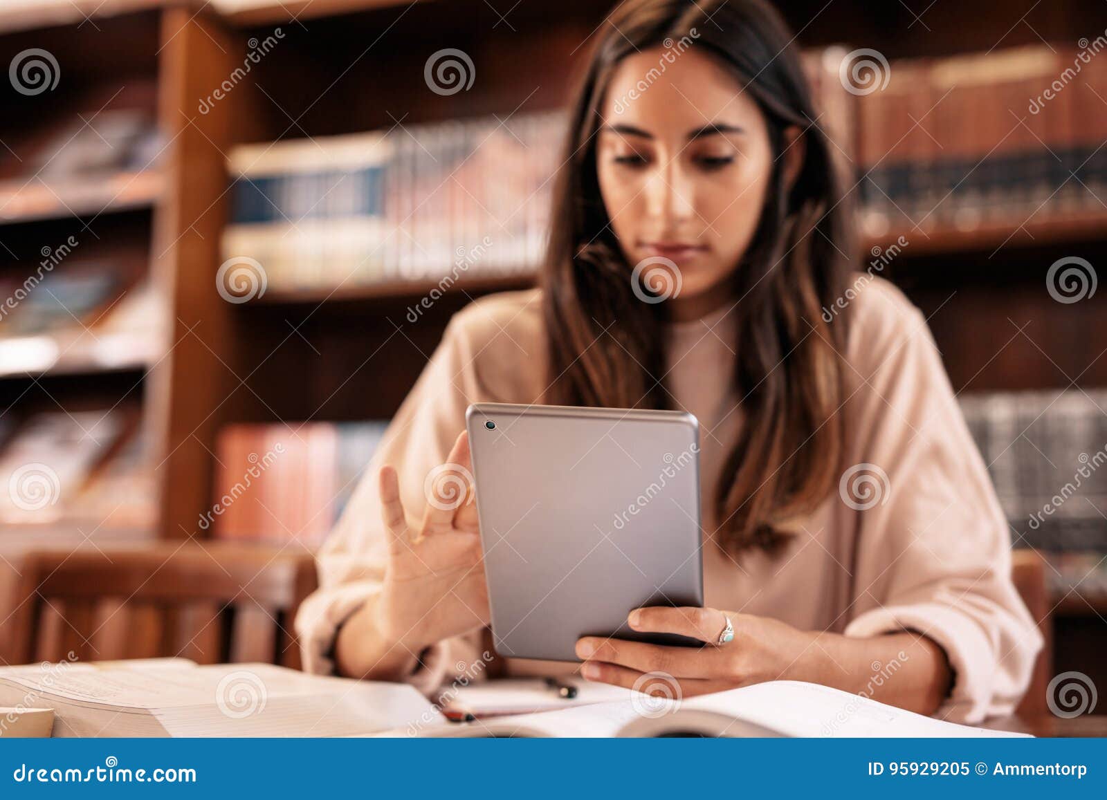 Female Student Using Digital Tablet in Library Stock Image - Image of ...