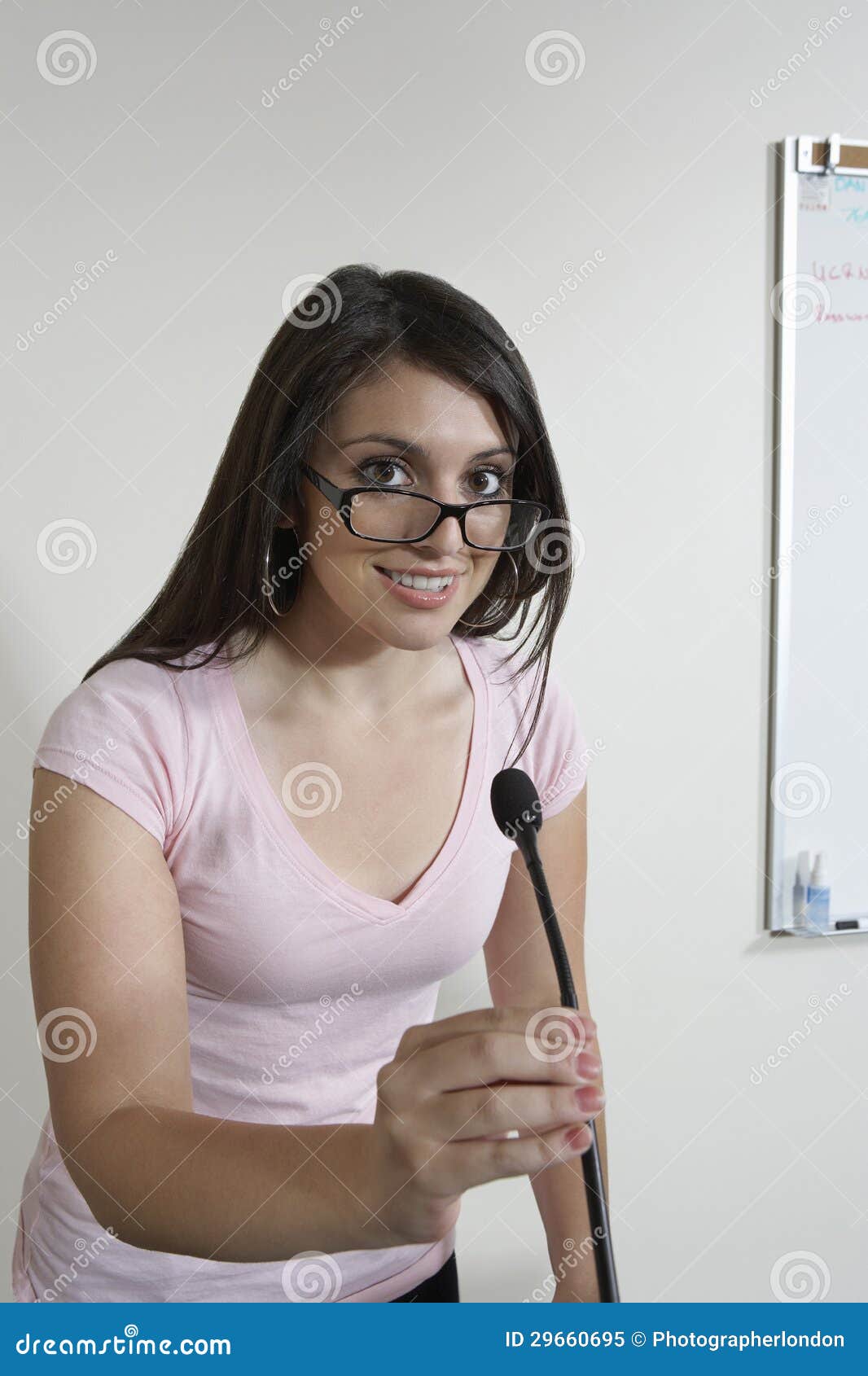 Female Student Using Microphone Stock Image - Image of learning ...
