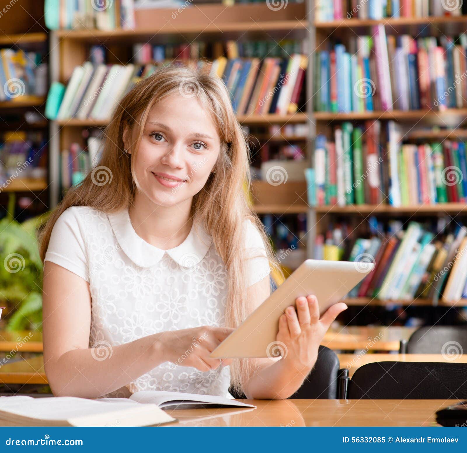 Female Student Using a Tablet Computer in a Library Stock Image - Image ...