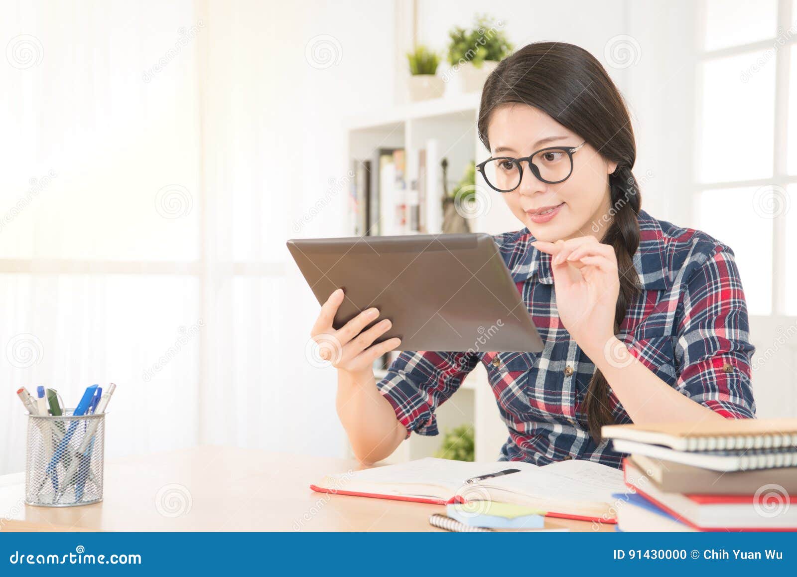 Female Student Using a Tablet Computer Stock Photo - Image of research ...