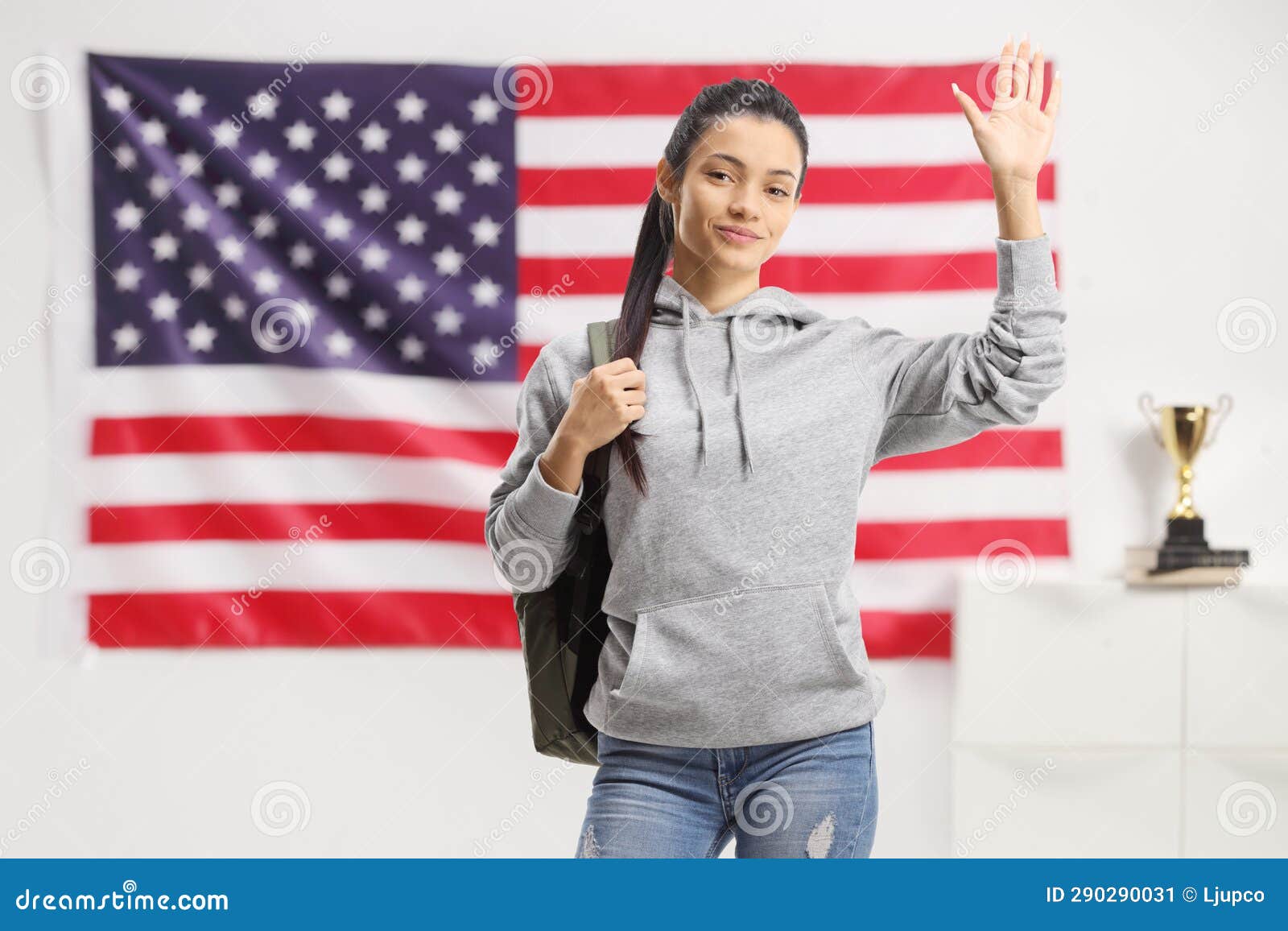 Female Student Waving in Front of USA Flag Stock Image - Image of ...