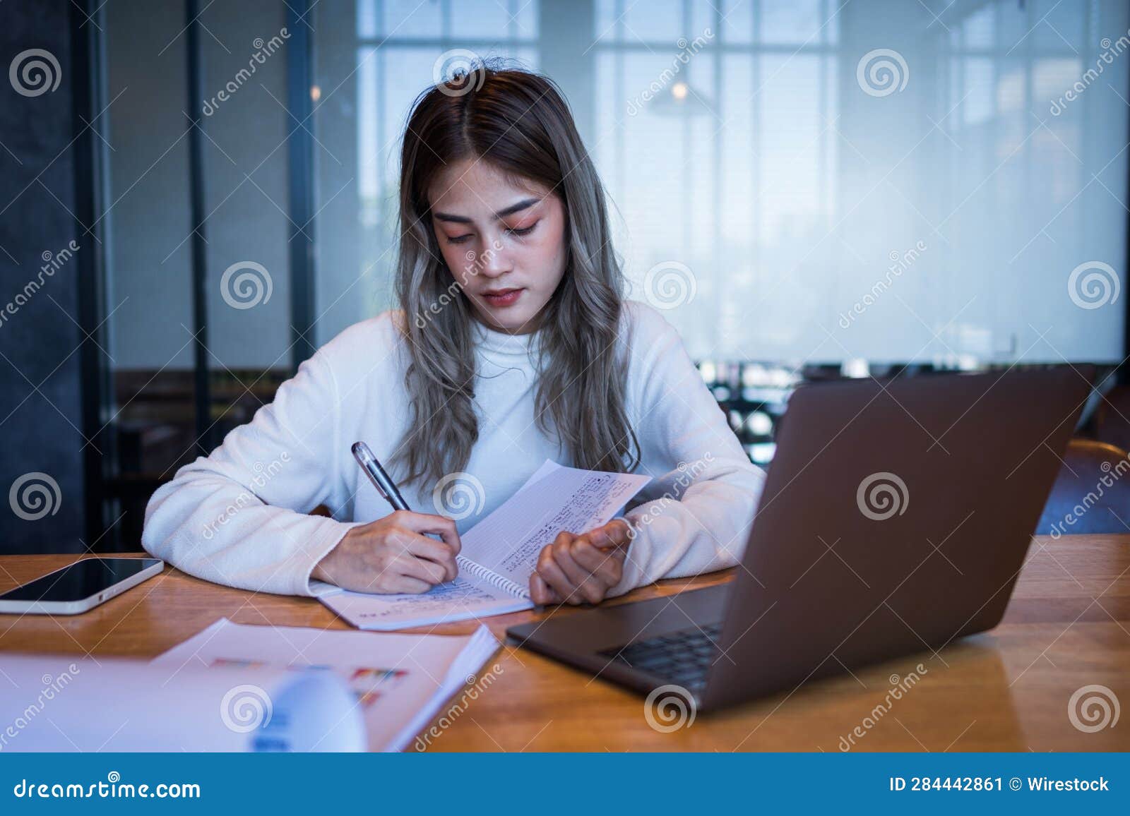 Female Student Working on a Laptop while Seated at a Desk Stock Image ...