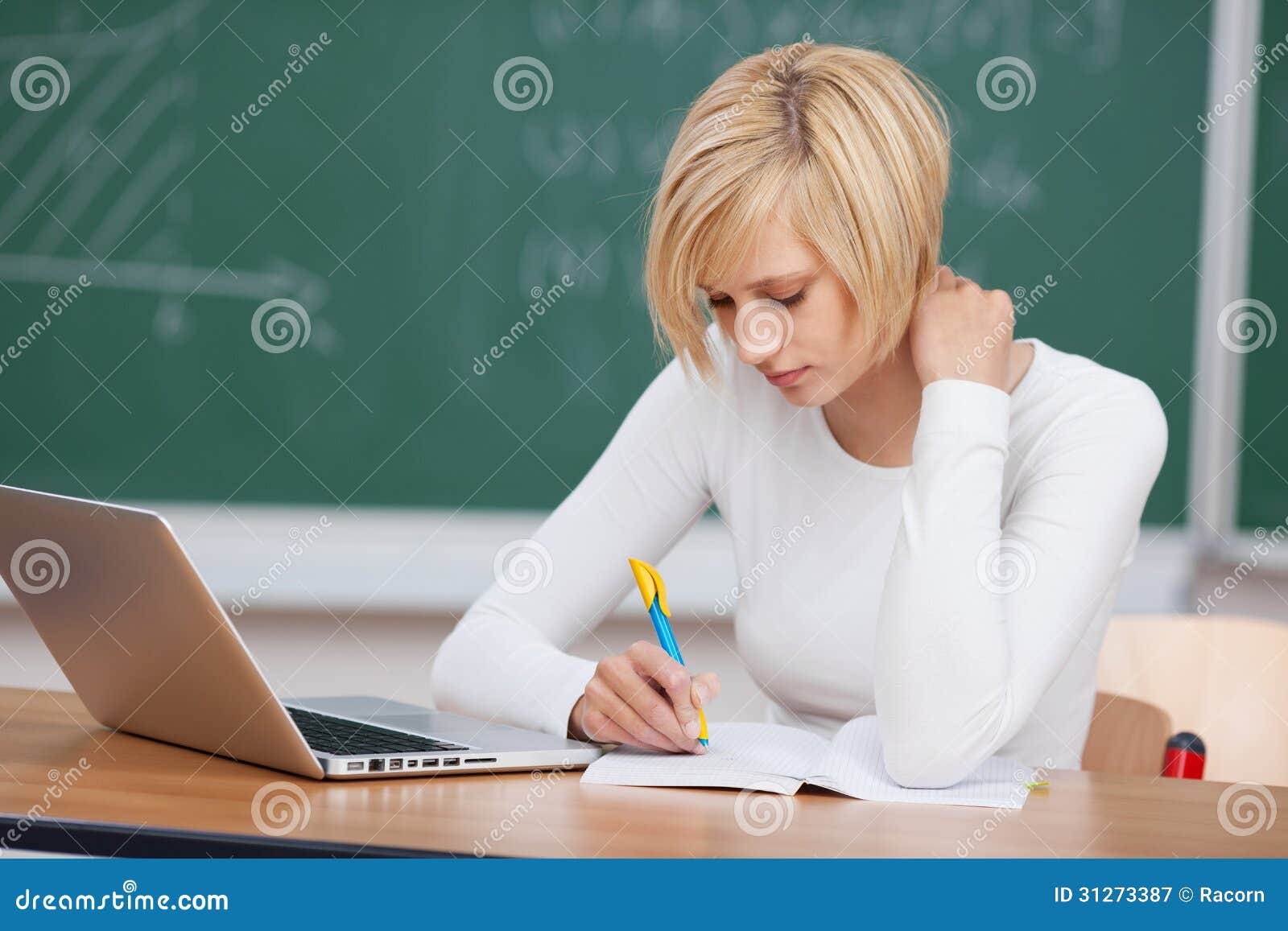 Female Student Writing Concentrated Stock Image - Image of adult, blond ...
