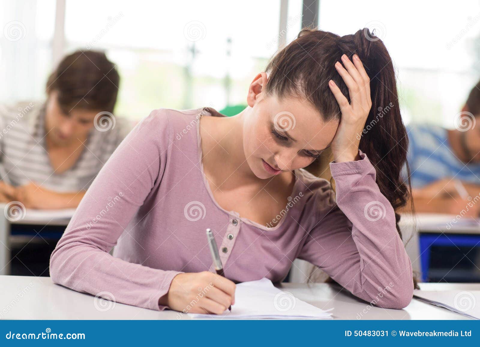 Female Student Writing Notes in Classroom Stock Image - Image of class ...
