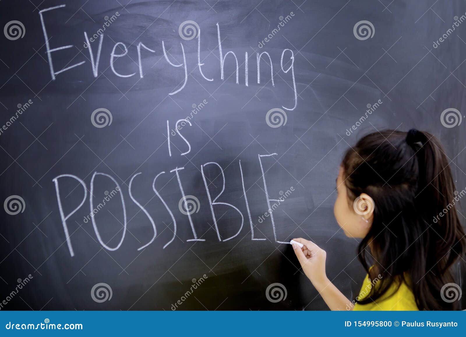 Female Student Writing Text of Everything is Possible Stock Photo ...