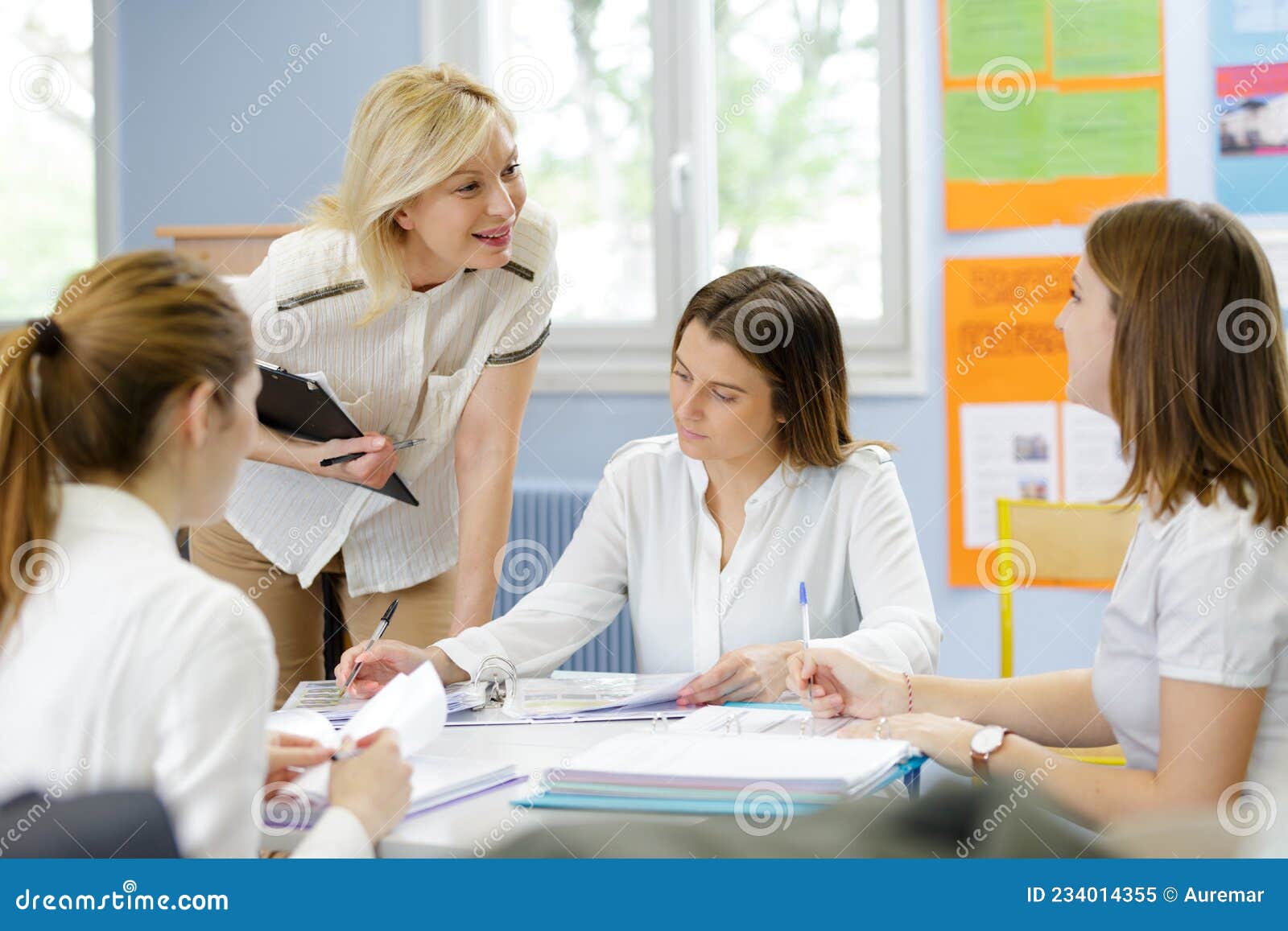 Female students in class stock image. Image of school - 234014355