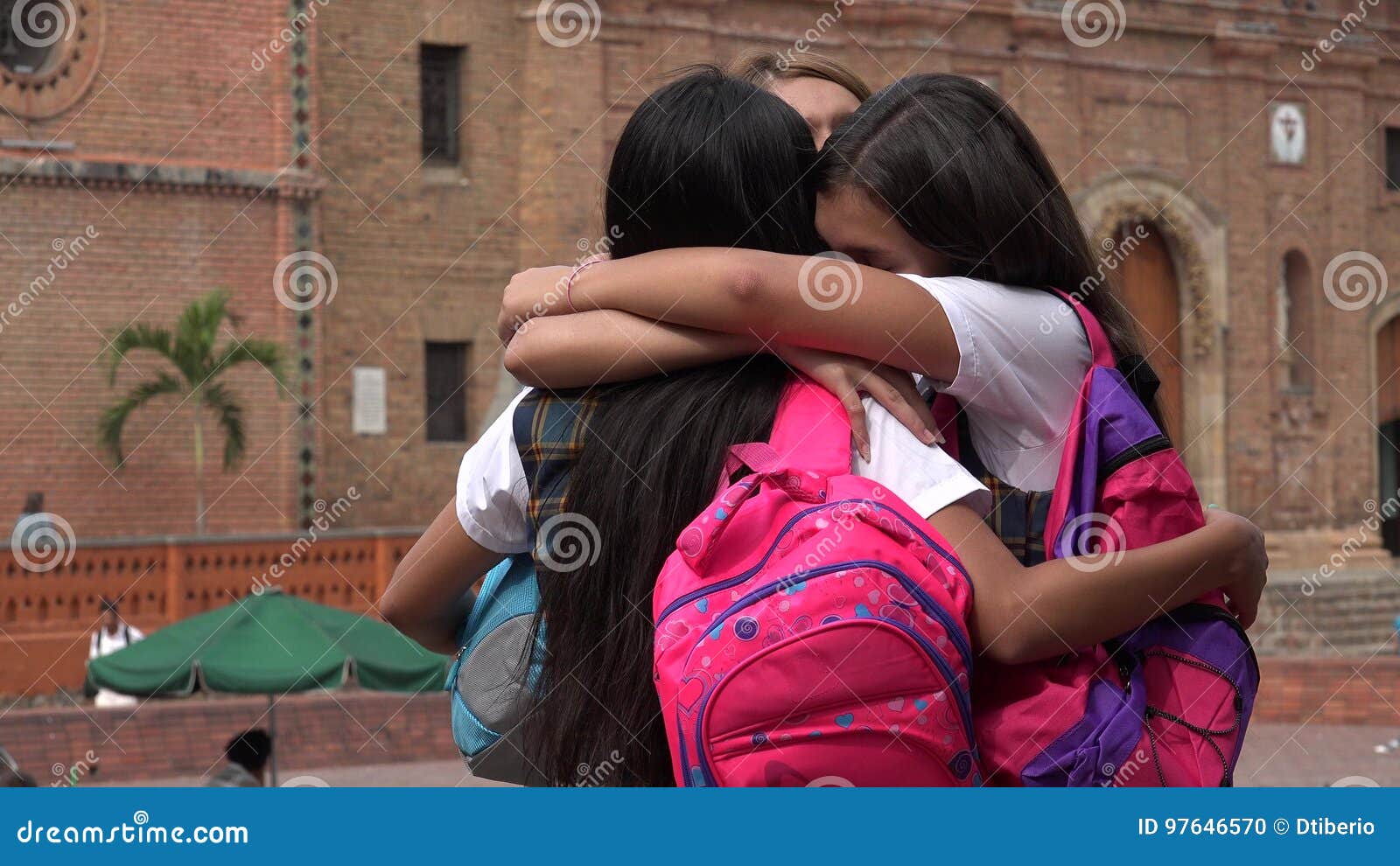 Female Students Hugging stock photo. Image of hold, students - 97646570