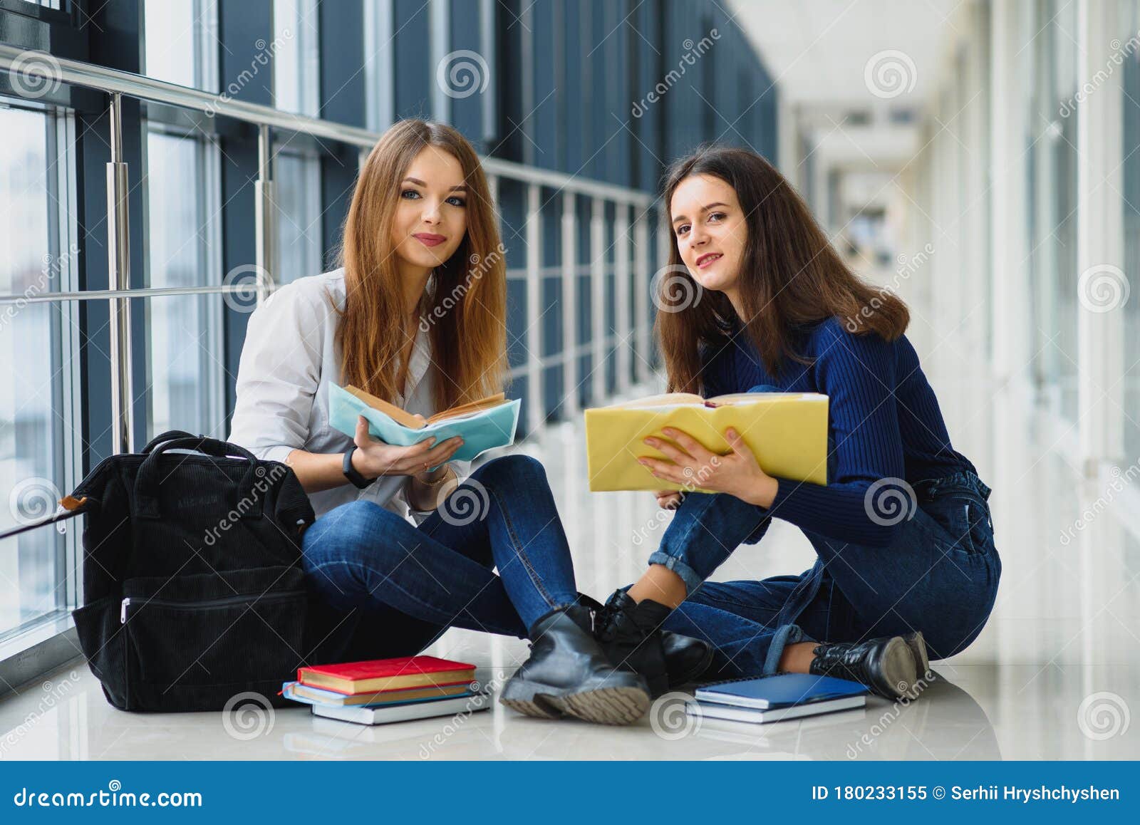 Female Students Sitting on the Floor and Reading Notes before Exam ...
