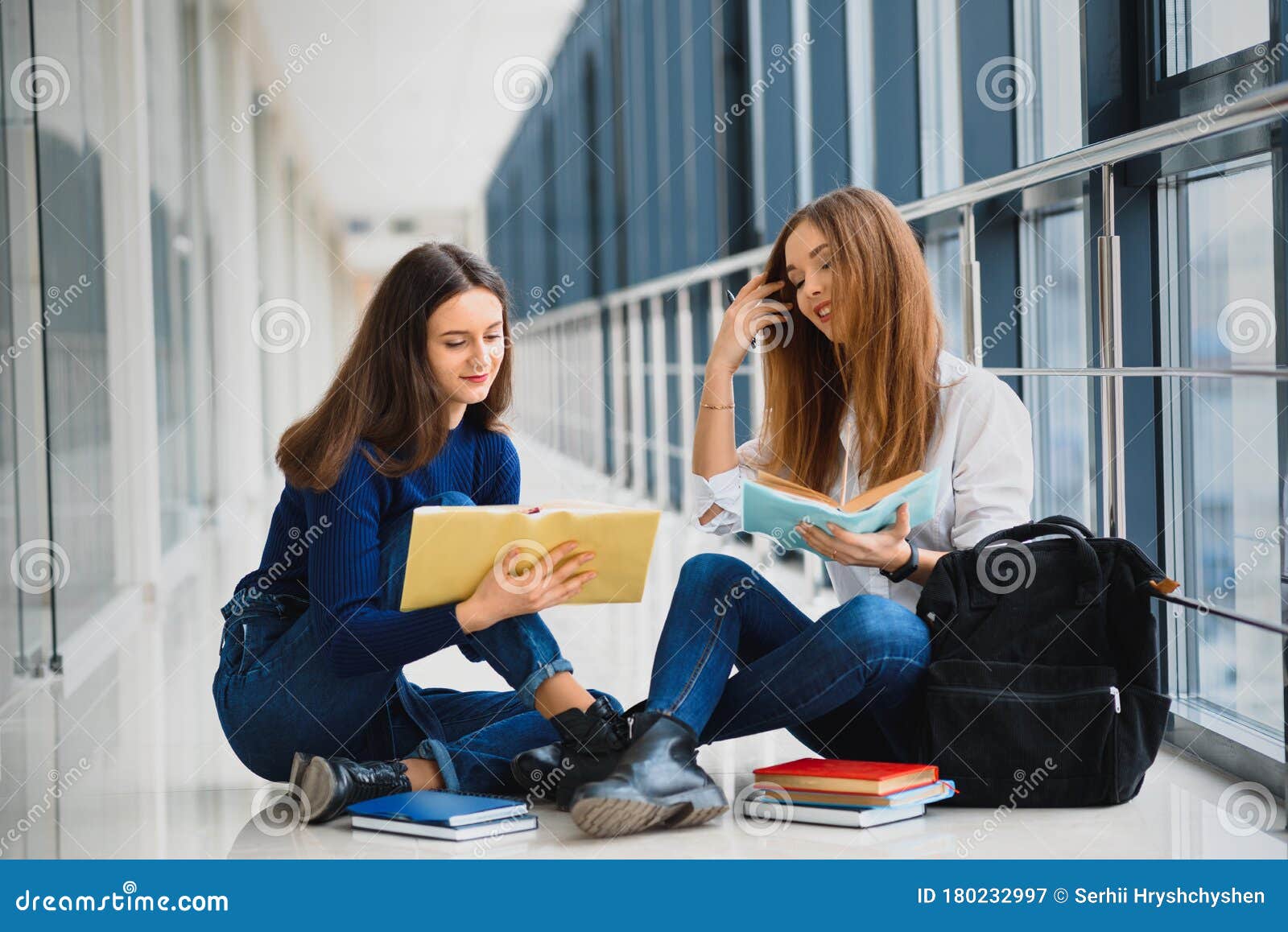 Female Students Sitting on the Floor and Reading Notes before Exam ...