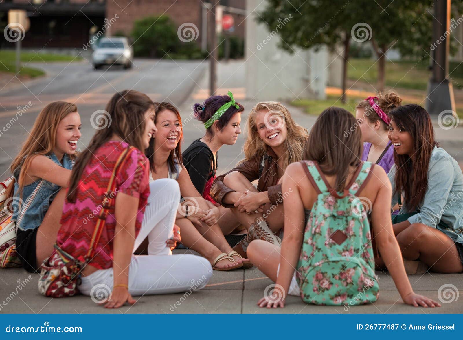 Female Students Sitting on the Ground Stock Image - Image of ...