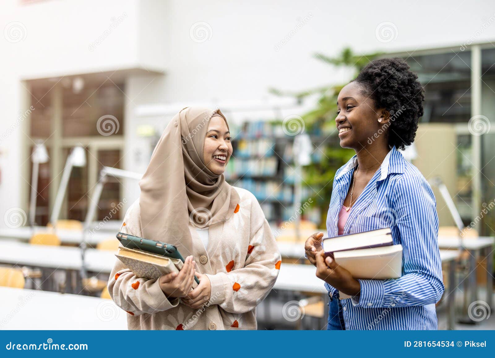Female Students Standing in a Library Stock Photo - Image of teenager ...
