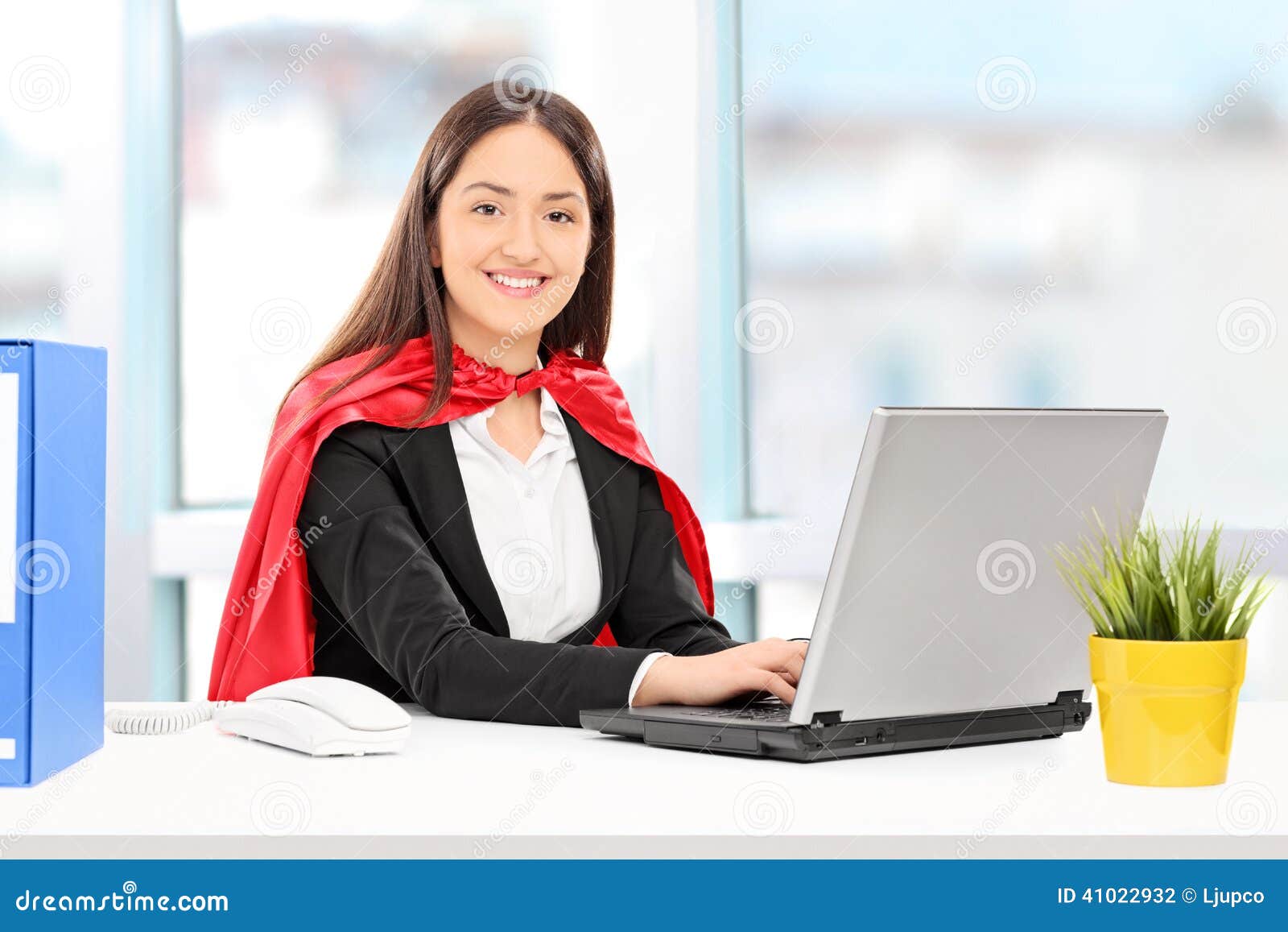 Female Superhero Working on Laptop in an Office Stock Photo - Image of ...