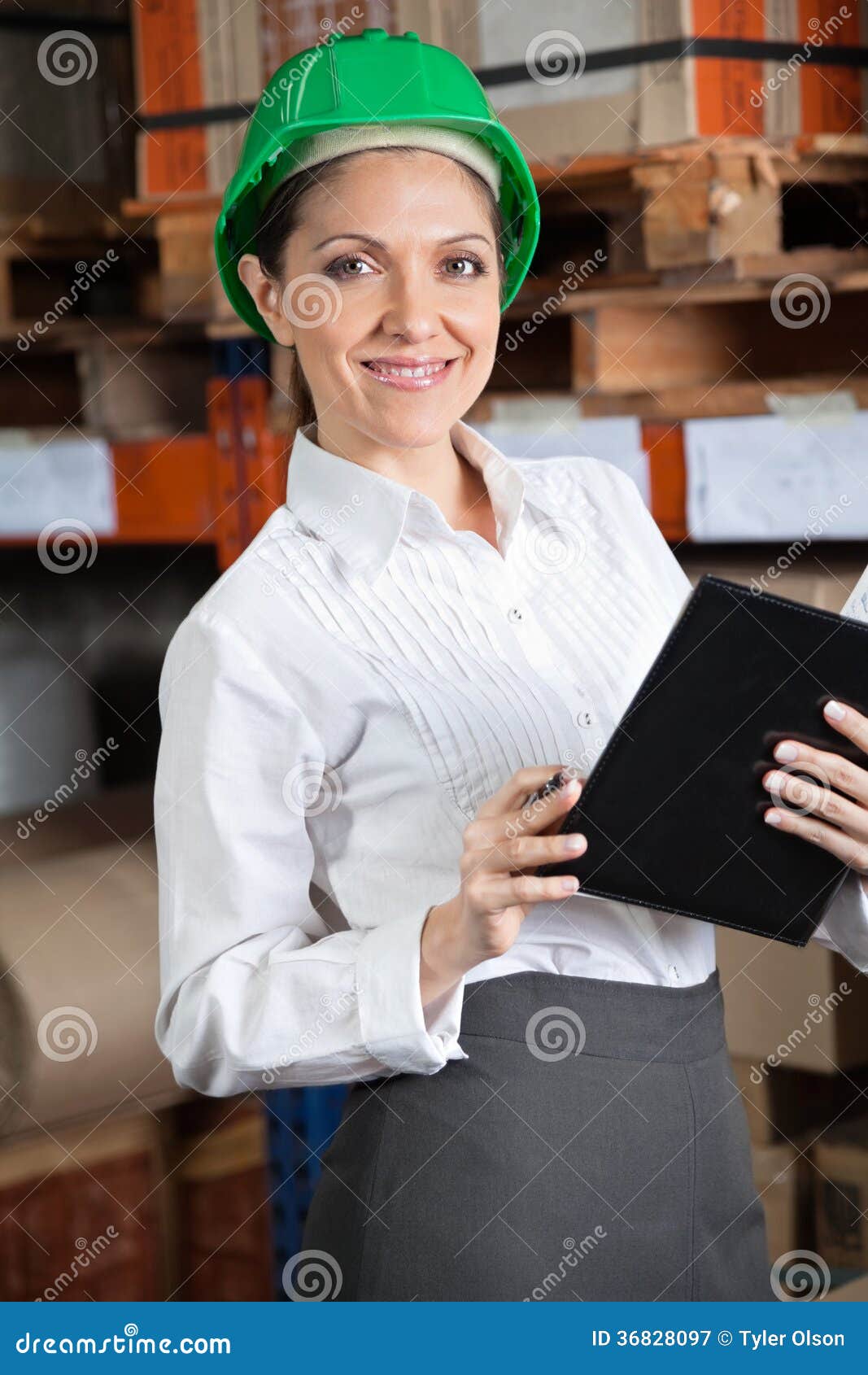 Female Supervisor with Book at Warehouse Stock Image - Image of adult ...