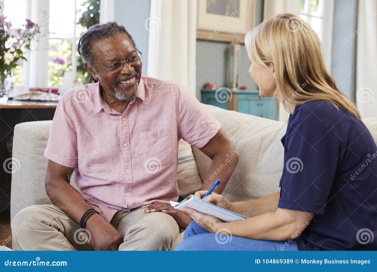 Female Support Worker Visits Senior Man at Home Stock Image - Image of ...