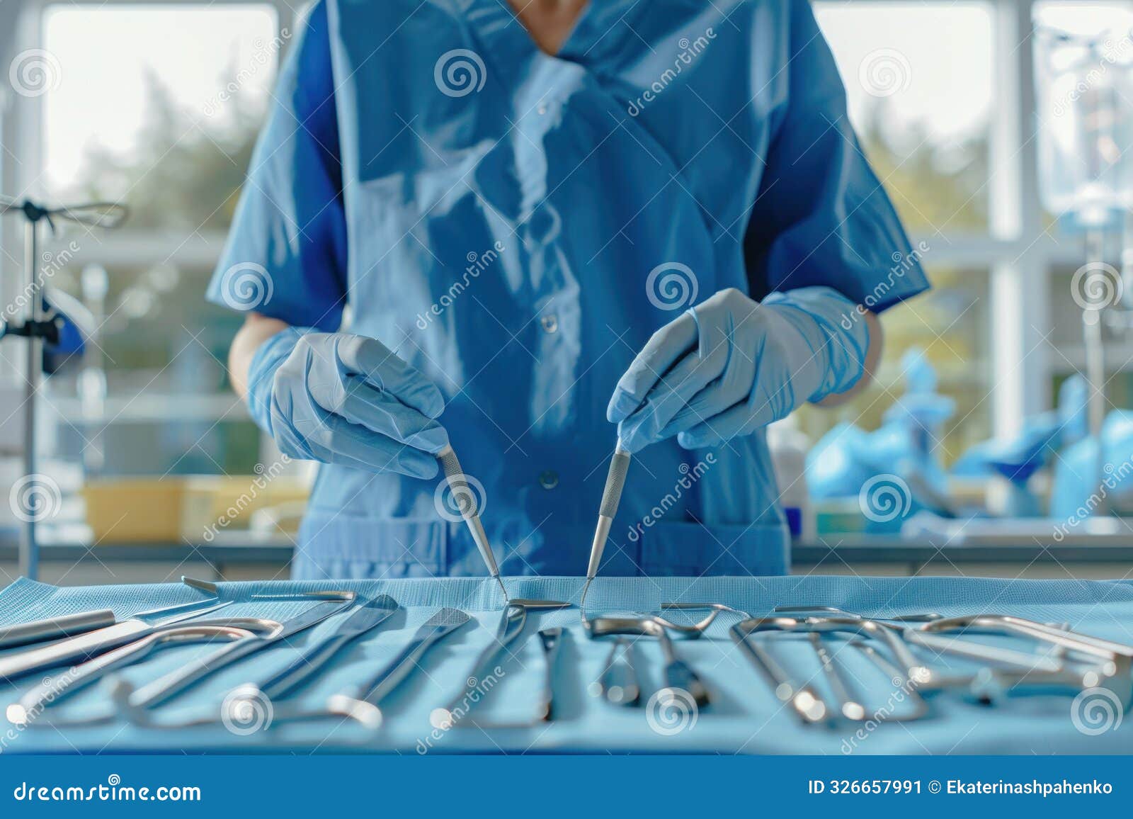 A Female Surgeon in Blue Scrubs is Preparing Surgical Instruments on an ...