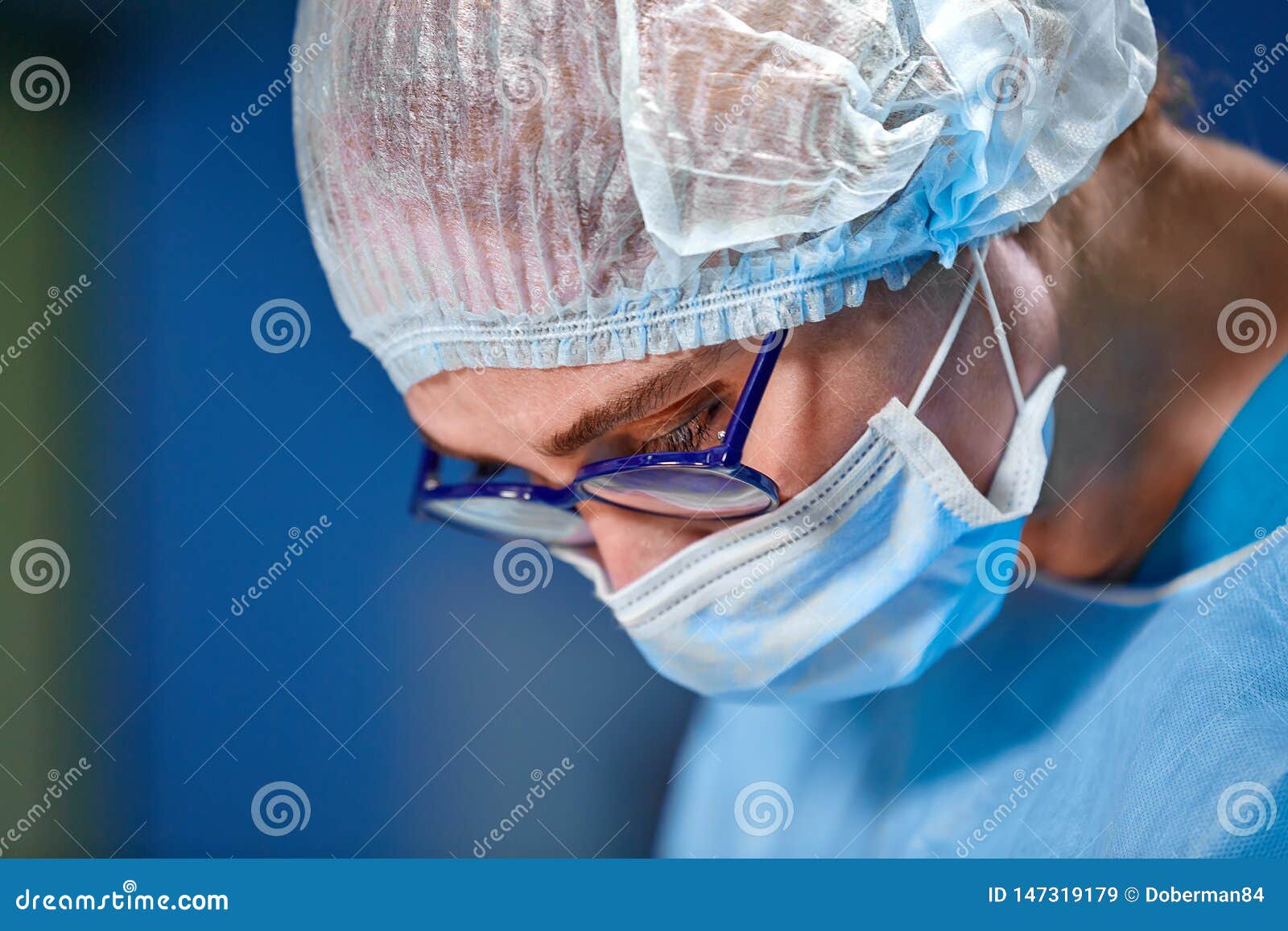 Female Surgeon in Operation Room with Reflection in Glasses Stock Image ...