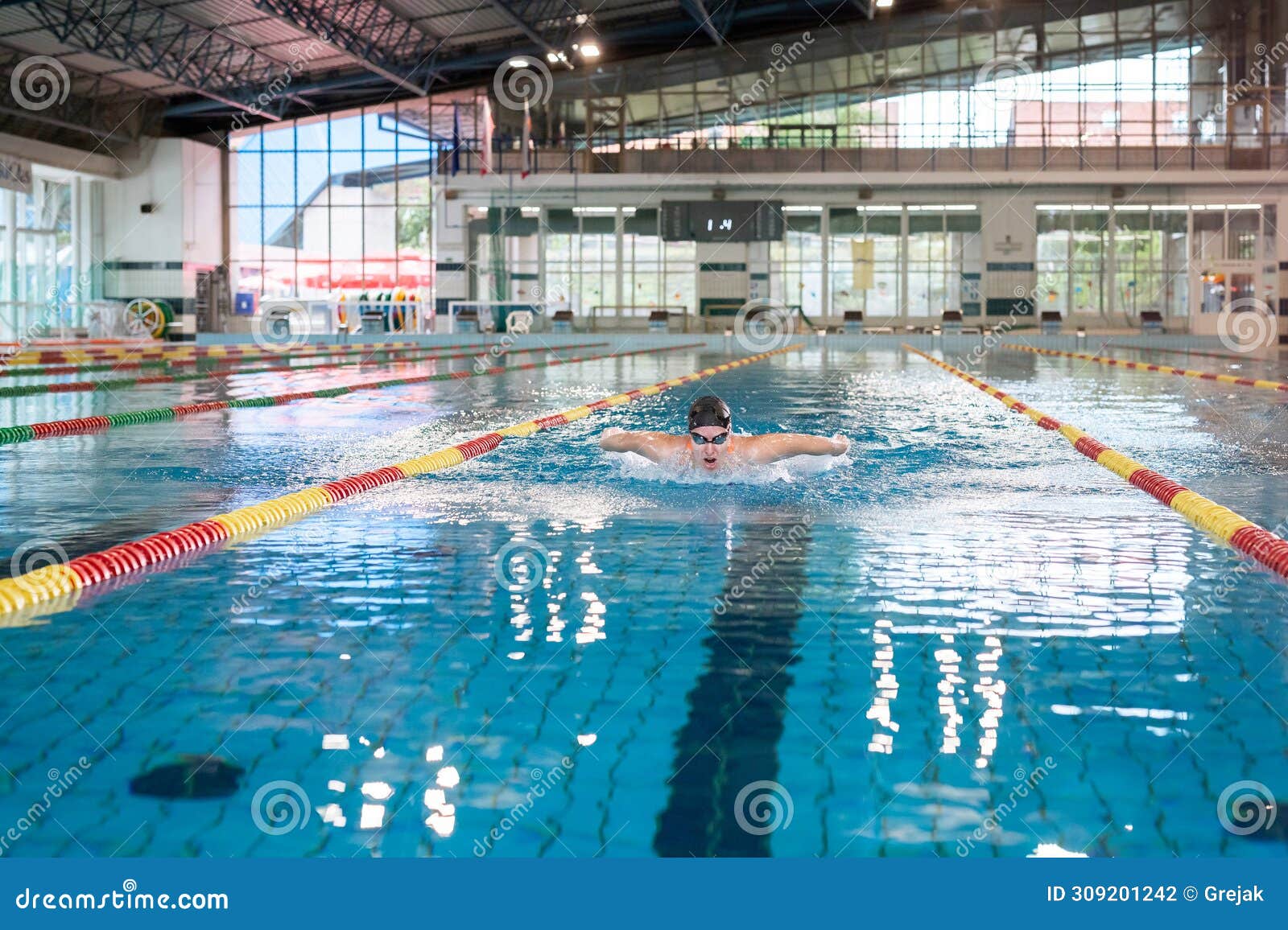 Female Swimmer Moving through the Water Performs a Butterfly Stroke ...