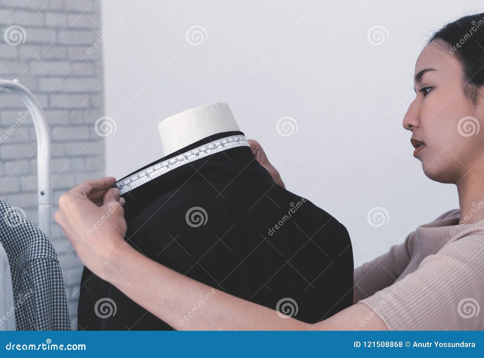 Female Tailor Measuring Jacket with Measuring Tape Stock Photo - Image ...