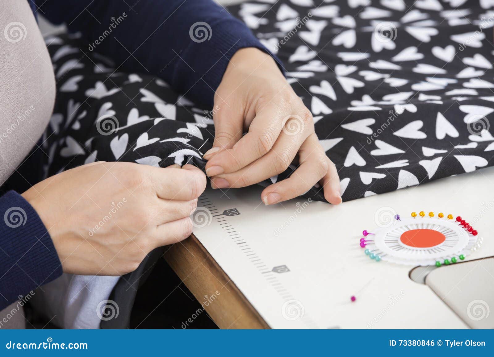 Female Tailor Stitching Fabric at Workbench Stock Photo - Image of ...