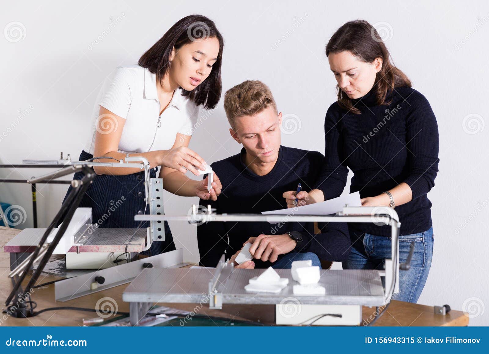 Female Teacher Explaining Architectural Modeling To Students Stock ...