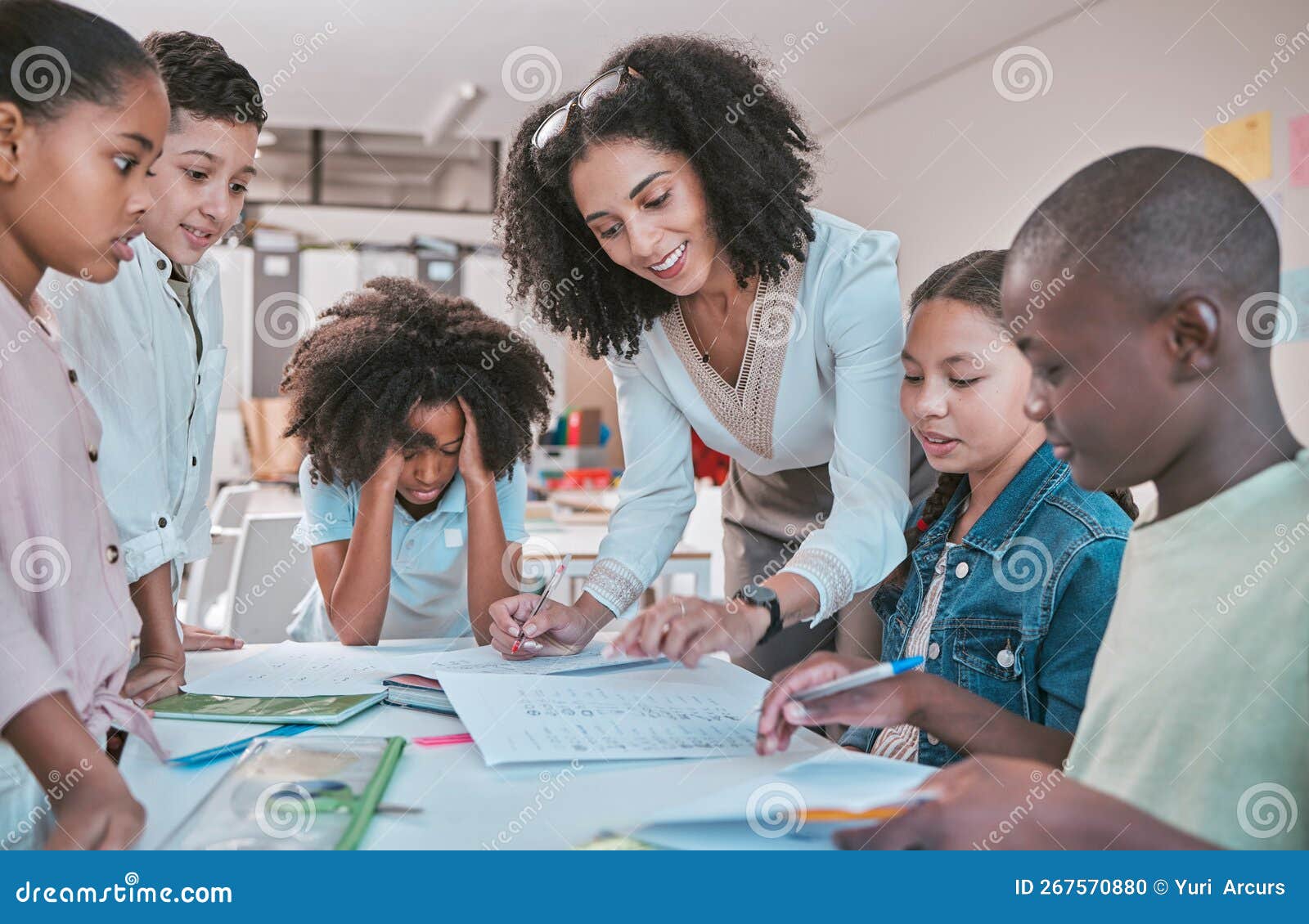 Female Teacher Helping Children with Assignment, Classroom in School ...