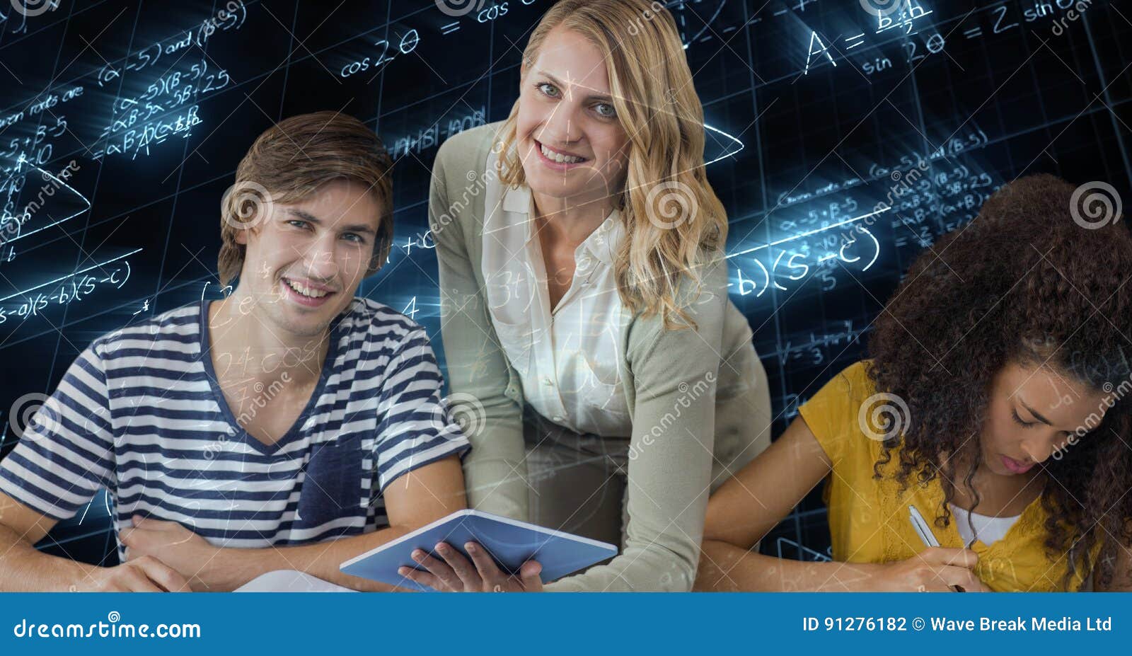 Female Teacher Holding Tablet PC by Students Against Math Equations ...