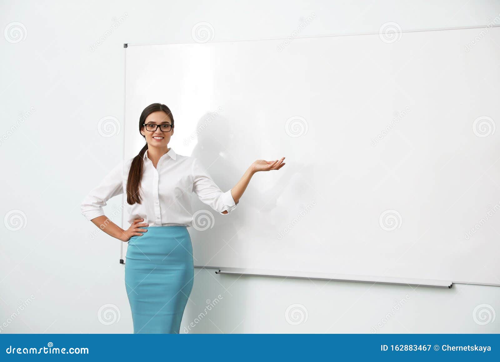 Female Teacher Near Whiteboard in Classroom Stock Image - Image of ...