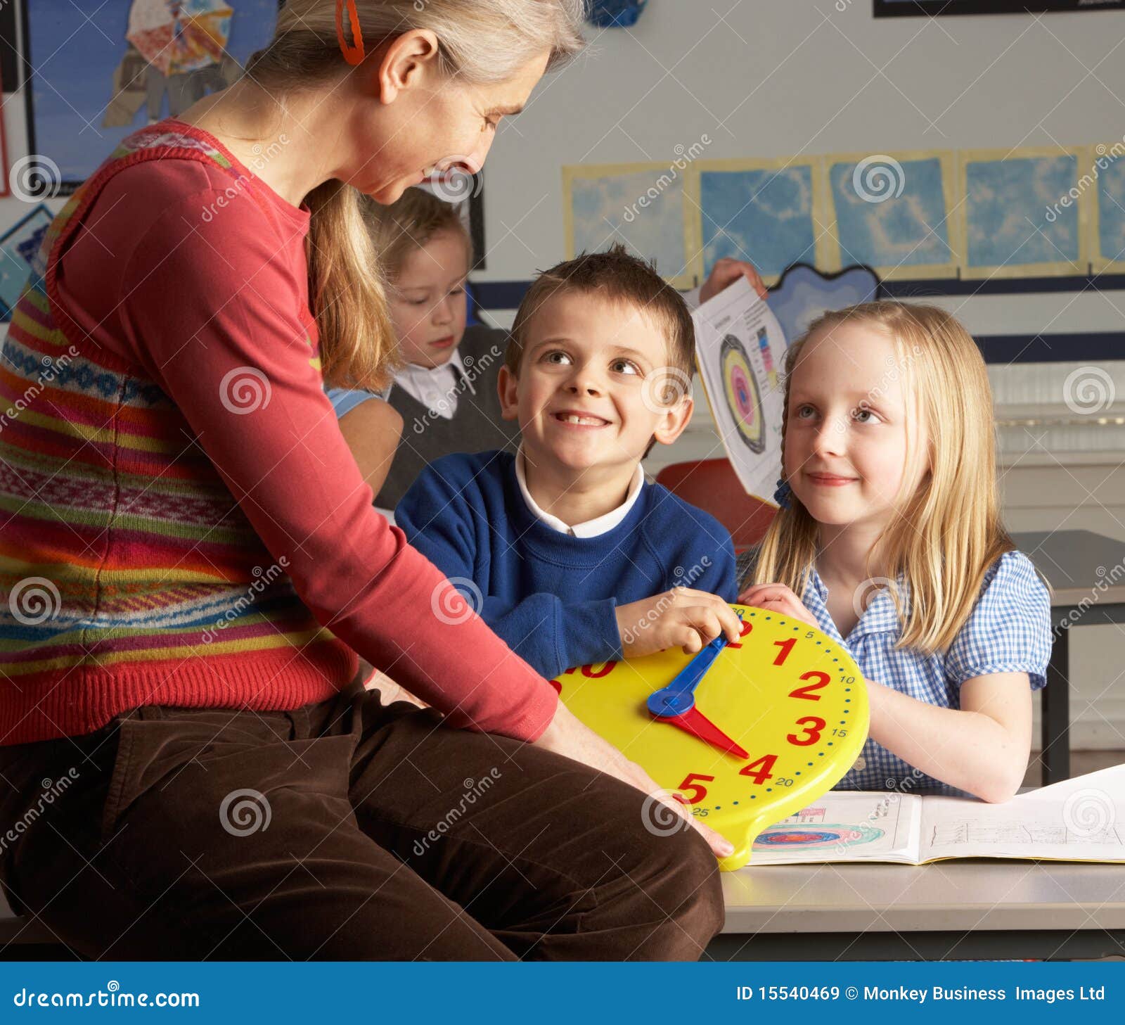 Female Teacher In Primary School Teaching Children Royalty Free Stock ...