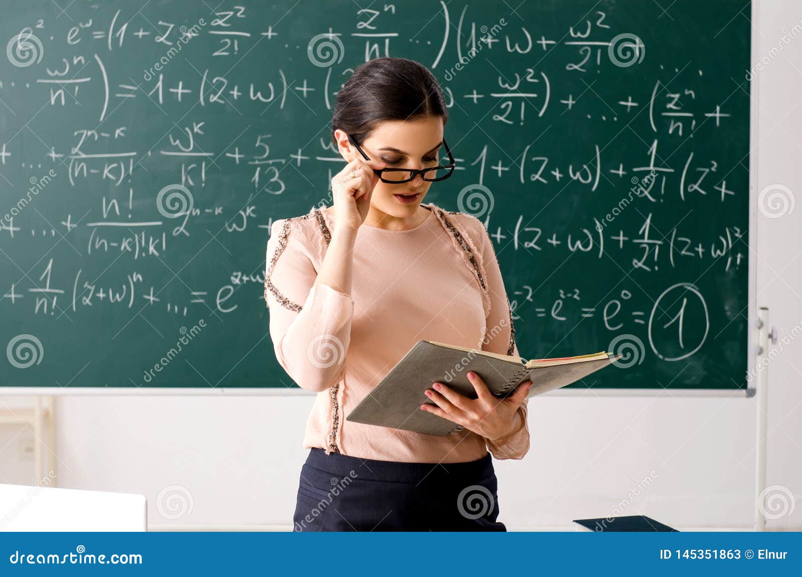The Female Teacher Standing in Front of Chalkboard Stock Image - Image ...
