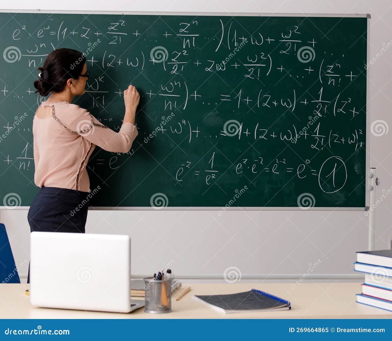 Female Teacher Standing in Front of Chalkboard Stock Image - Image of ...