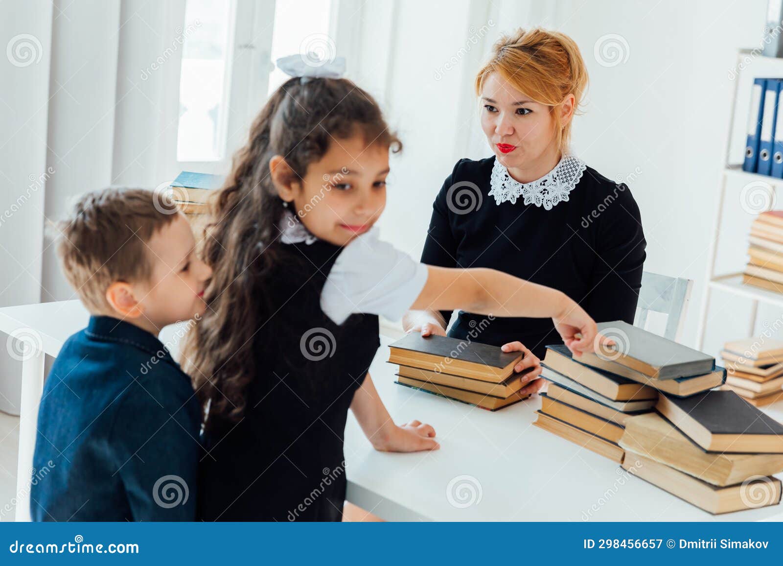 Female Teacher Teaching Children in School Classroom Stock Image ...