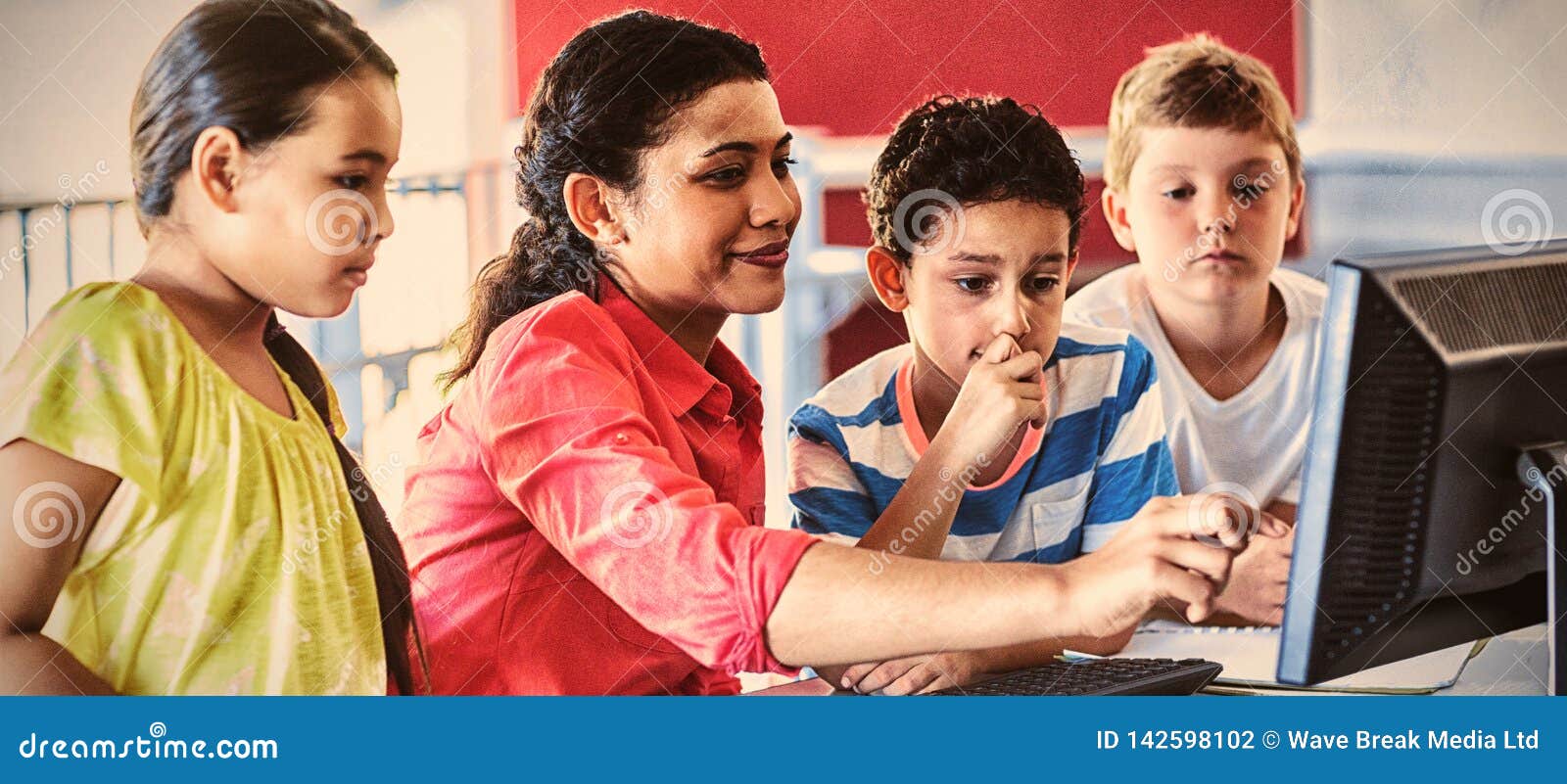 Female Teacher Teaching Computer To Children Stock Photo - Image of ...