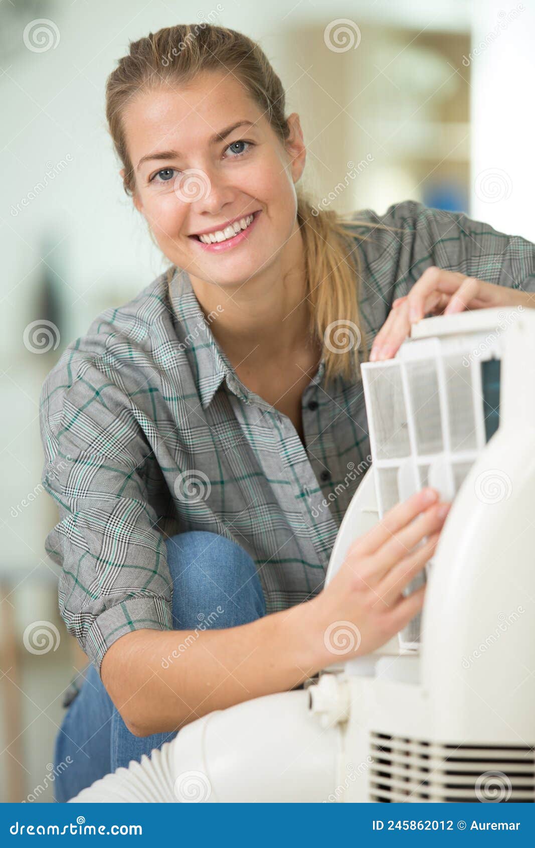 Female Technician Assembling Air-conditioning Unit Stock Photo - Image ...