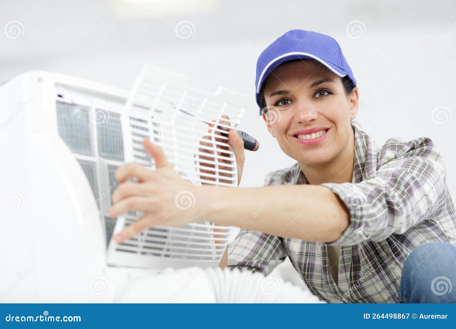 Female Technician Assembling Air-conditioning Unit Stock Image - Image ...
